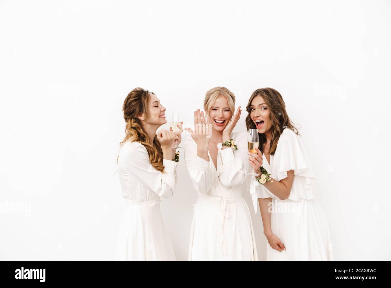 Photo of attractive happy bride showing her wedding ring at excited ...
