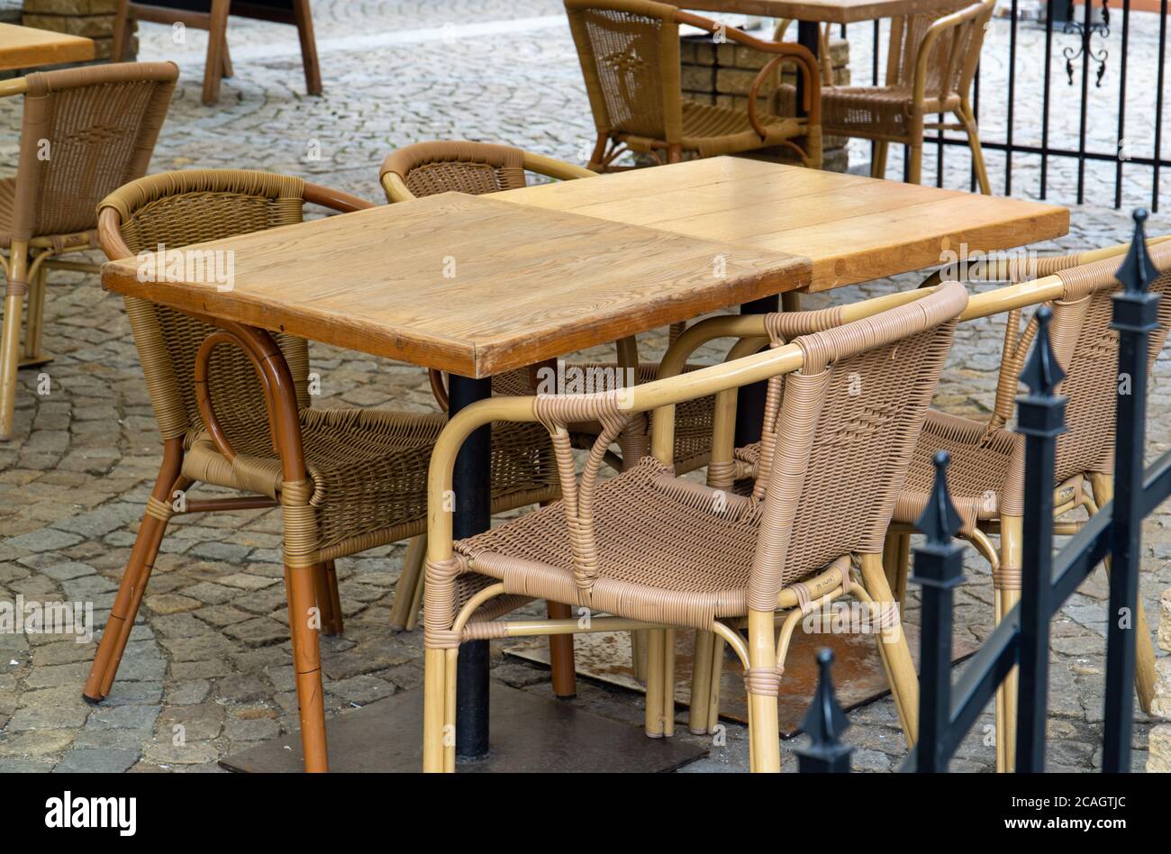 Wooden restaurant table and chairs set outside for clients Stock Photo ...