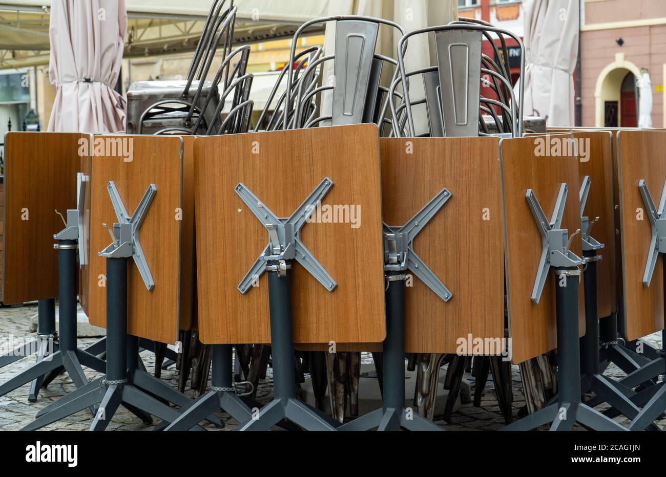 Folded restaurant tables, all set in one place in the morning Stock ...