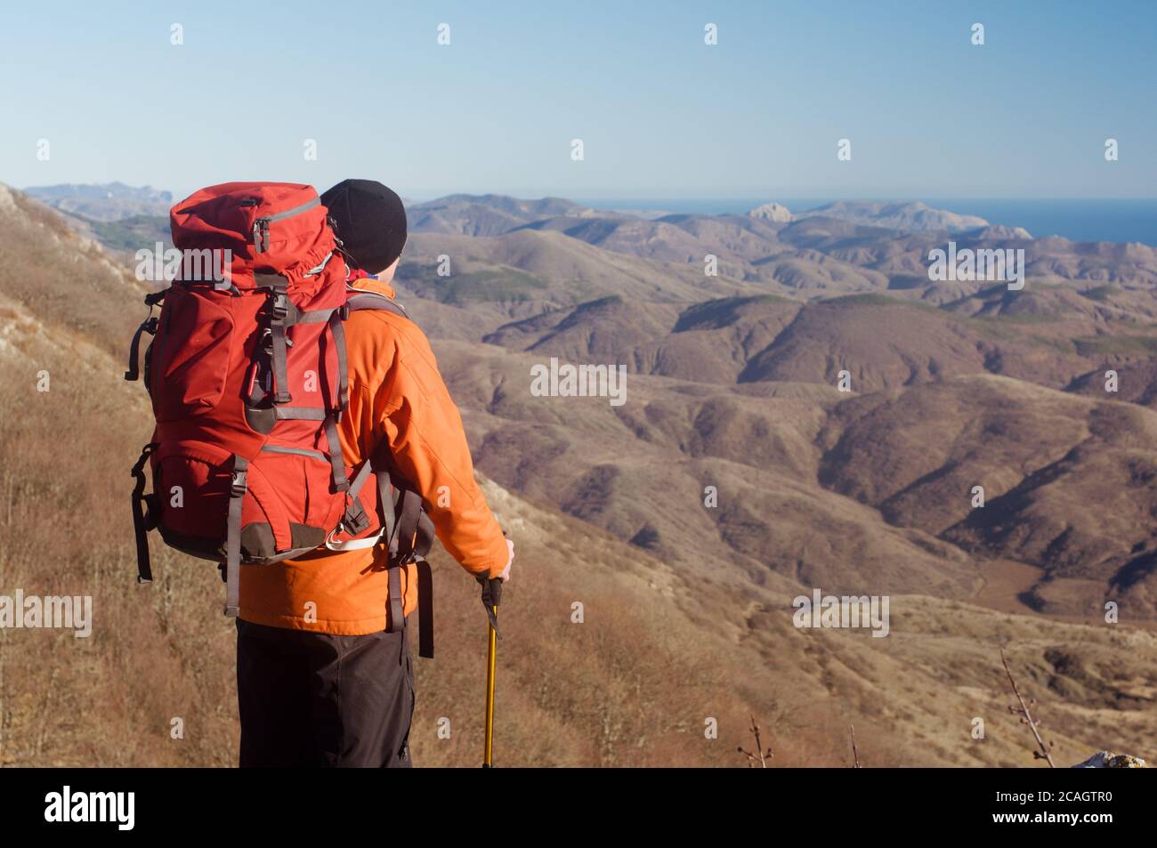 Hiking man with backpack Stock Photo - Alamy