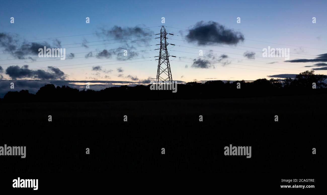 Electricity pylon with dark clouds hi-res stock photography and images ...