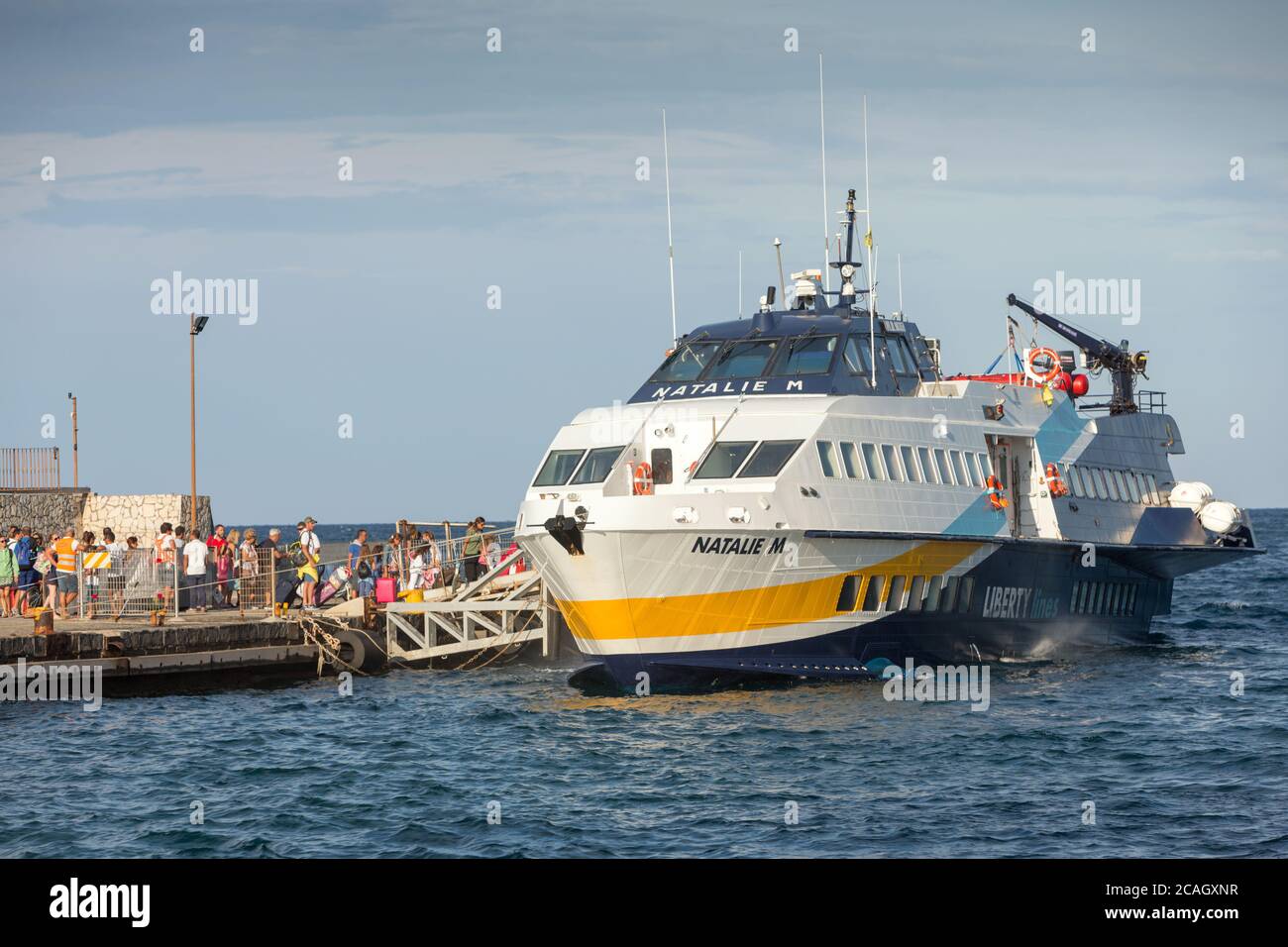 20.08.2018, Vulcano, Sicily, Italy - Tourists and locals board a high ...