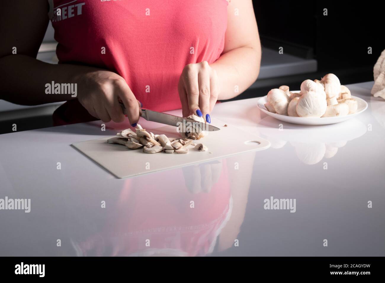 Human hands cut champignon mushrooms hi-res stock photography and ...