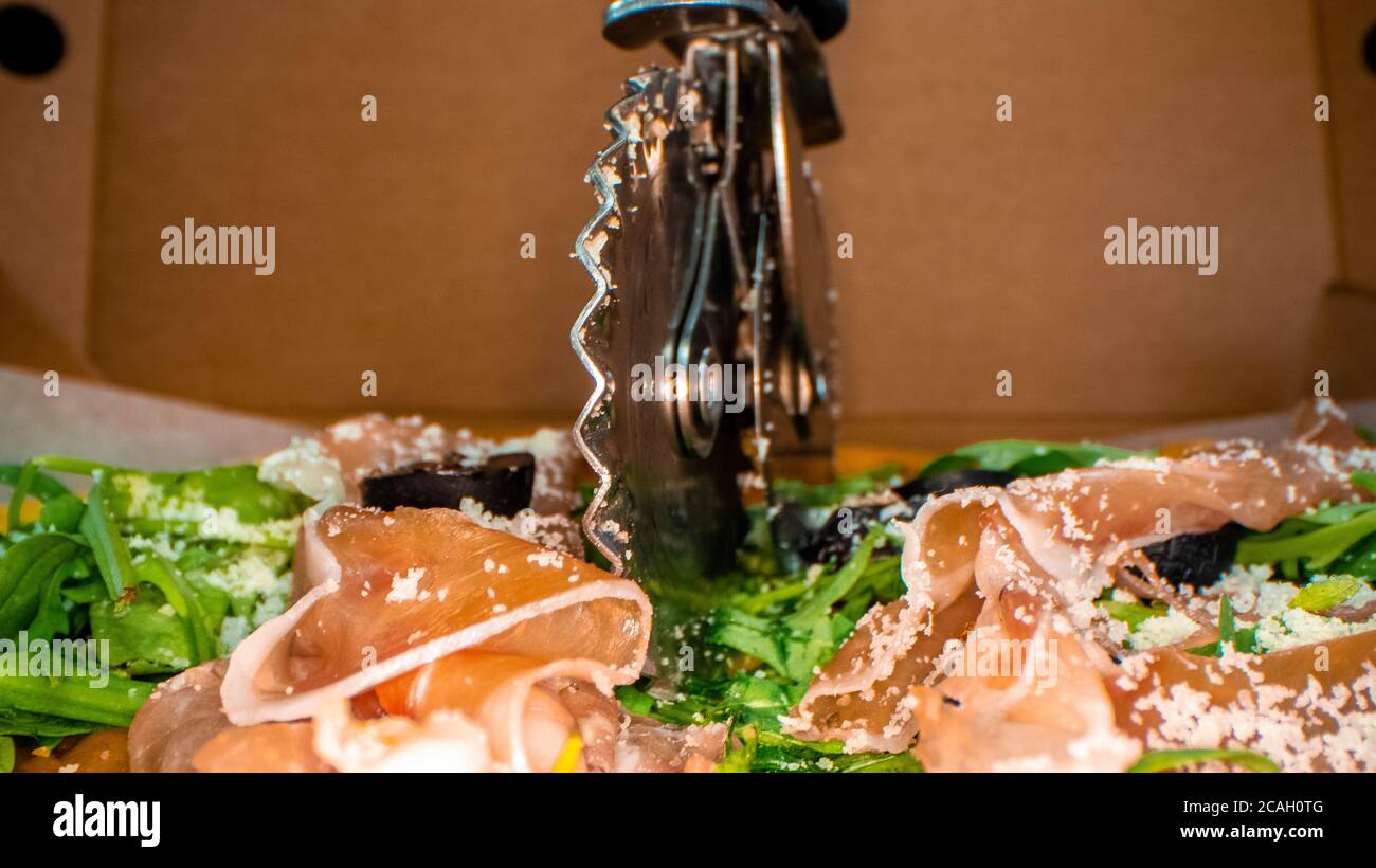Closeup pizza slicing process hi-res stock photography and images - Alamy
