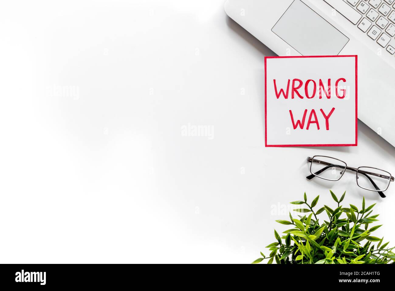 Wrong way icon on office desk - white, top view copy space Stock Photo ...