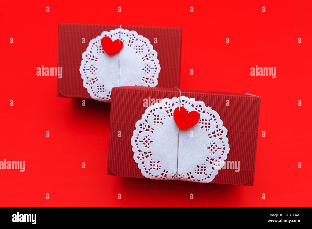 Rectangular gift box with circular white paper towel and red heart ...