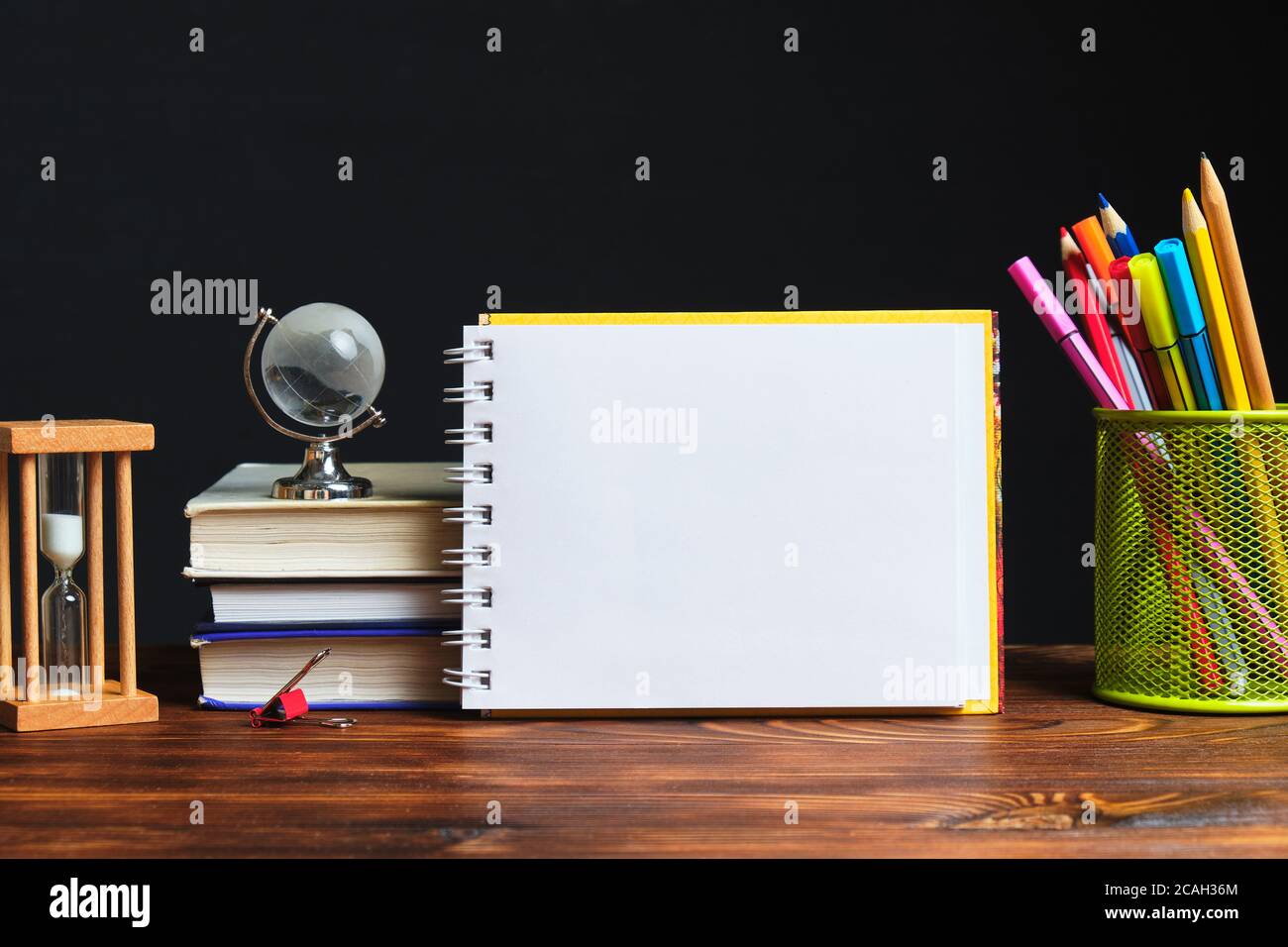 Stationery and books with copy space on notepad Stock Photo - Alamy