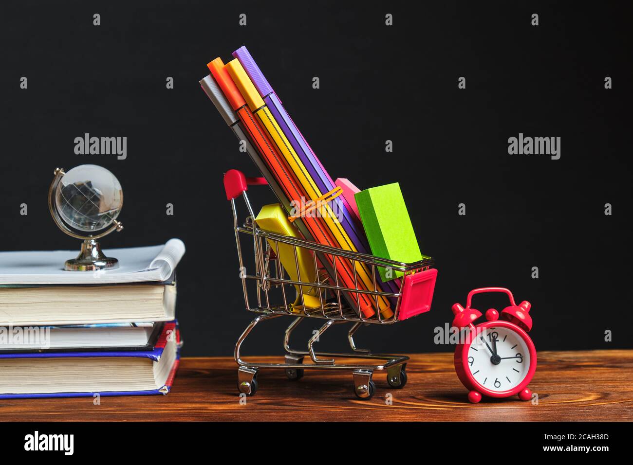 Shopping cart and concept back to school Stock Photo - Alamy