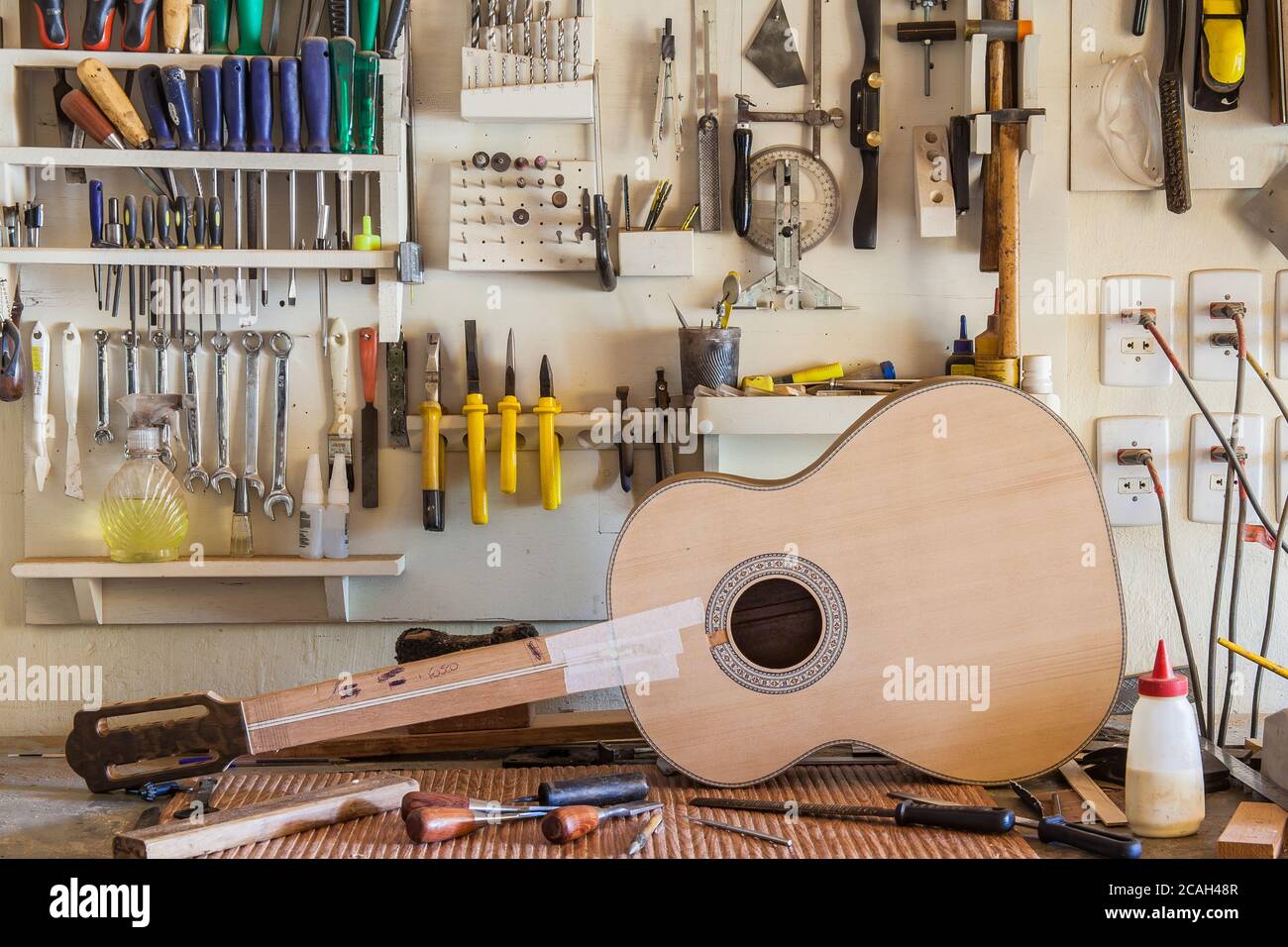 Classical guitar under construction in luthier workshop Stock Photo - Alamy