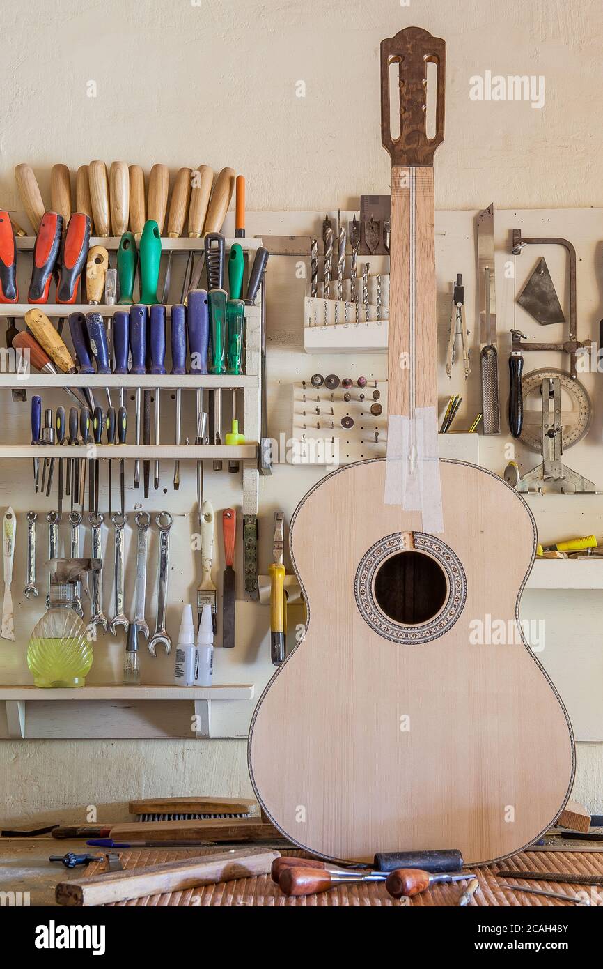 Classical guitar under construction in luthier workshop Stock Photo - Alamy