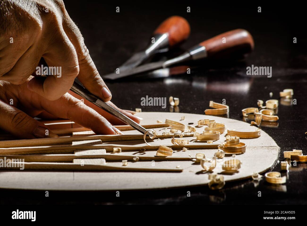 Luthier making top of guitar Stock Photo - Alamy