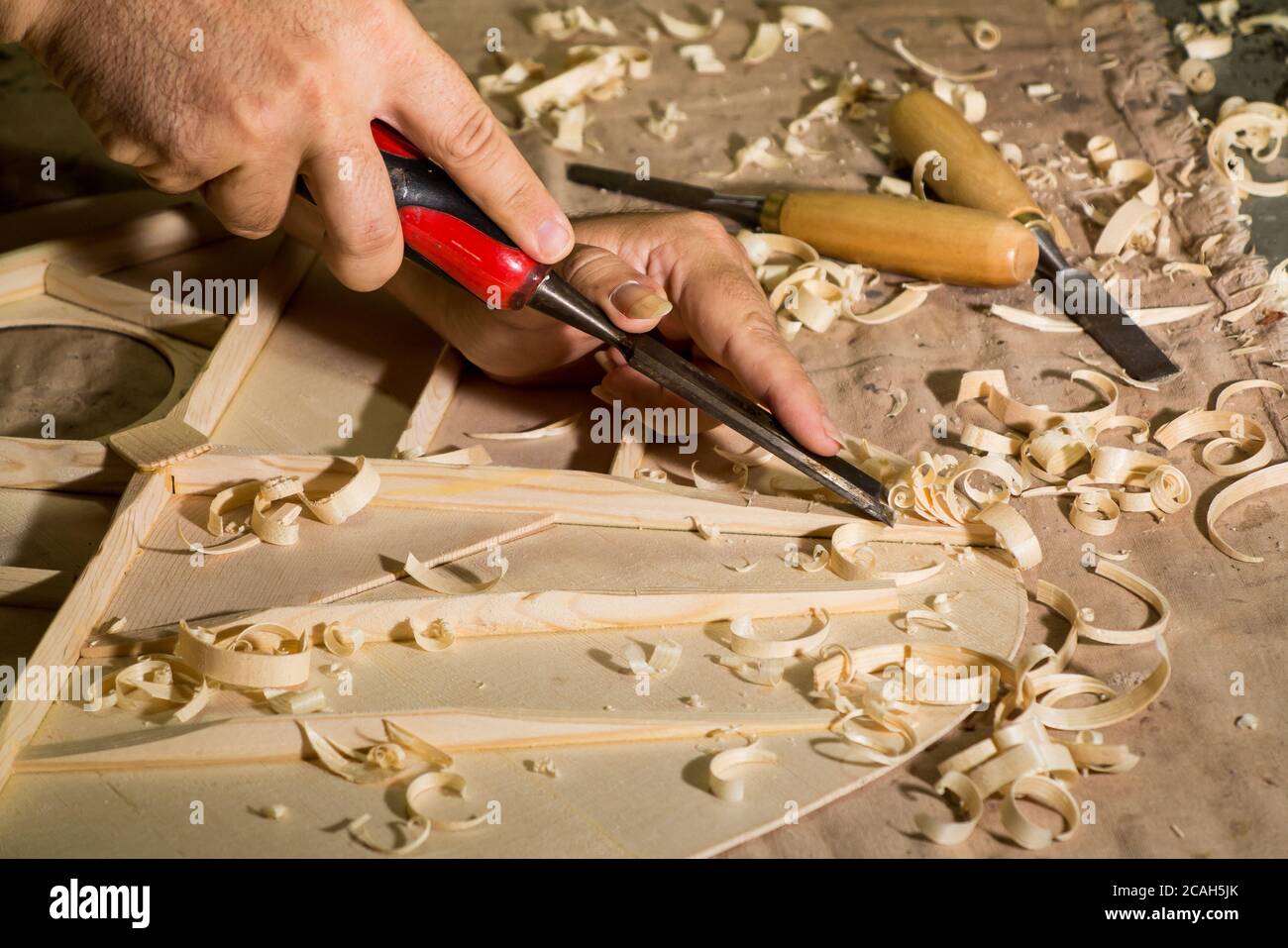 Luthier making top of guitar Stock Photo - Alamy