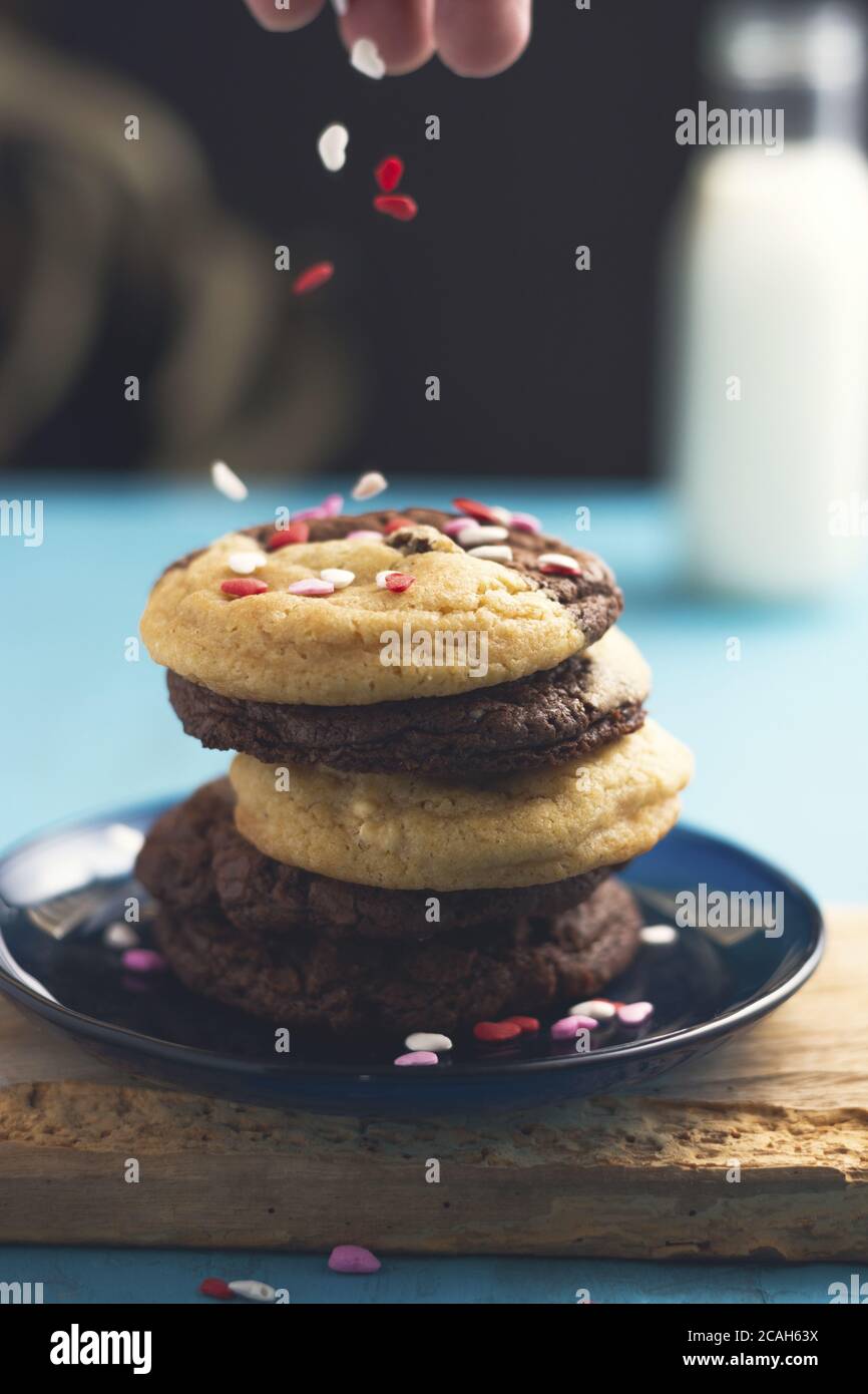 Delicious and sweet chocolate cookies stuck on each other on the plate ...