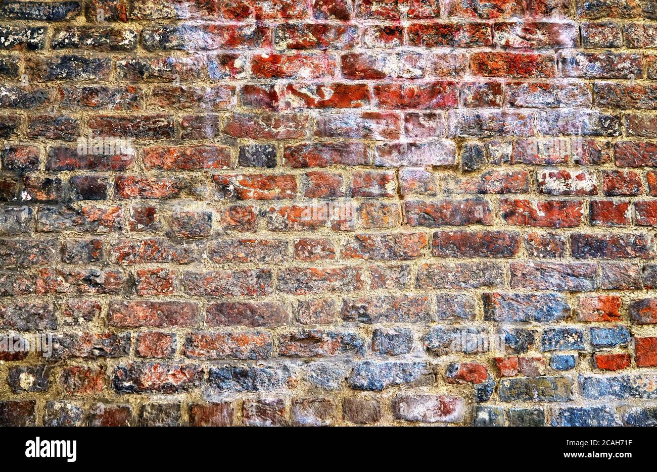 Weathered old brick wall in different colors Stock Photo - Alamy