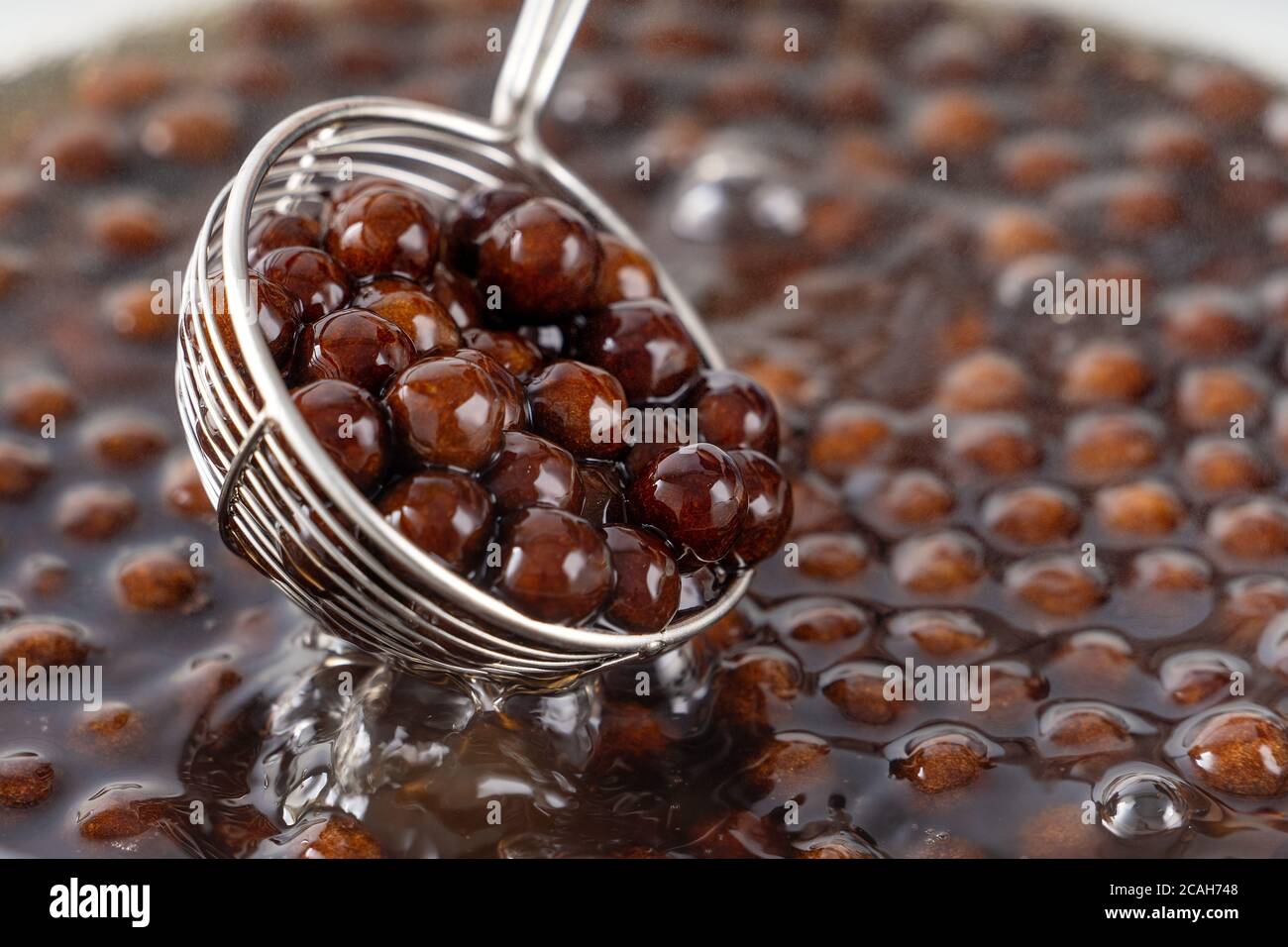 Cooking, boiling brown sugar flavor tapioca pearl balls, ingredient of ...