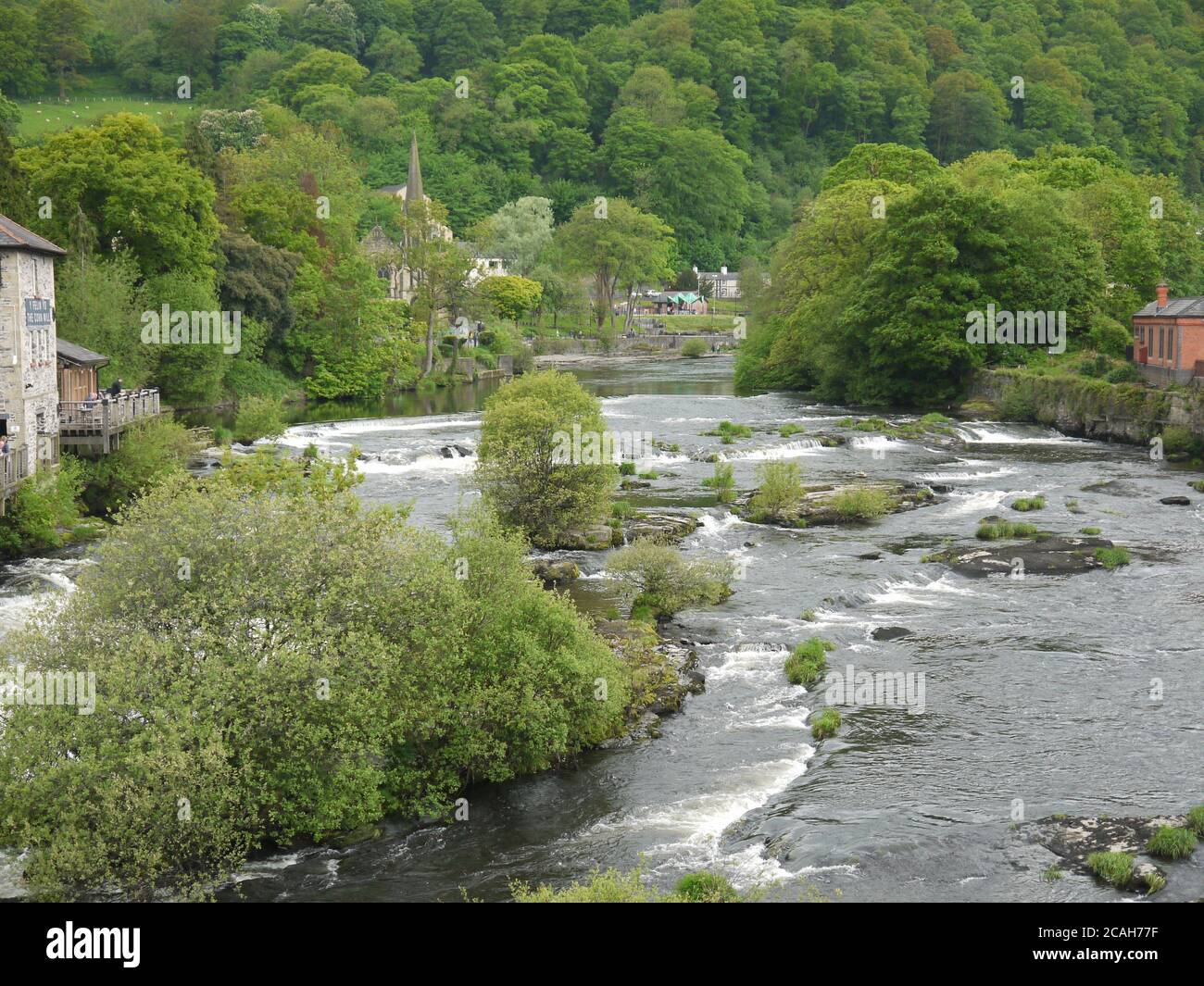 Fast-Flowing River through a Rural Town Stock Photo - Alamy