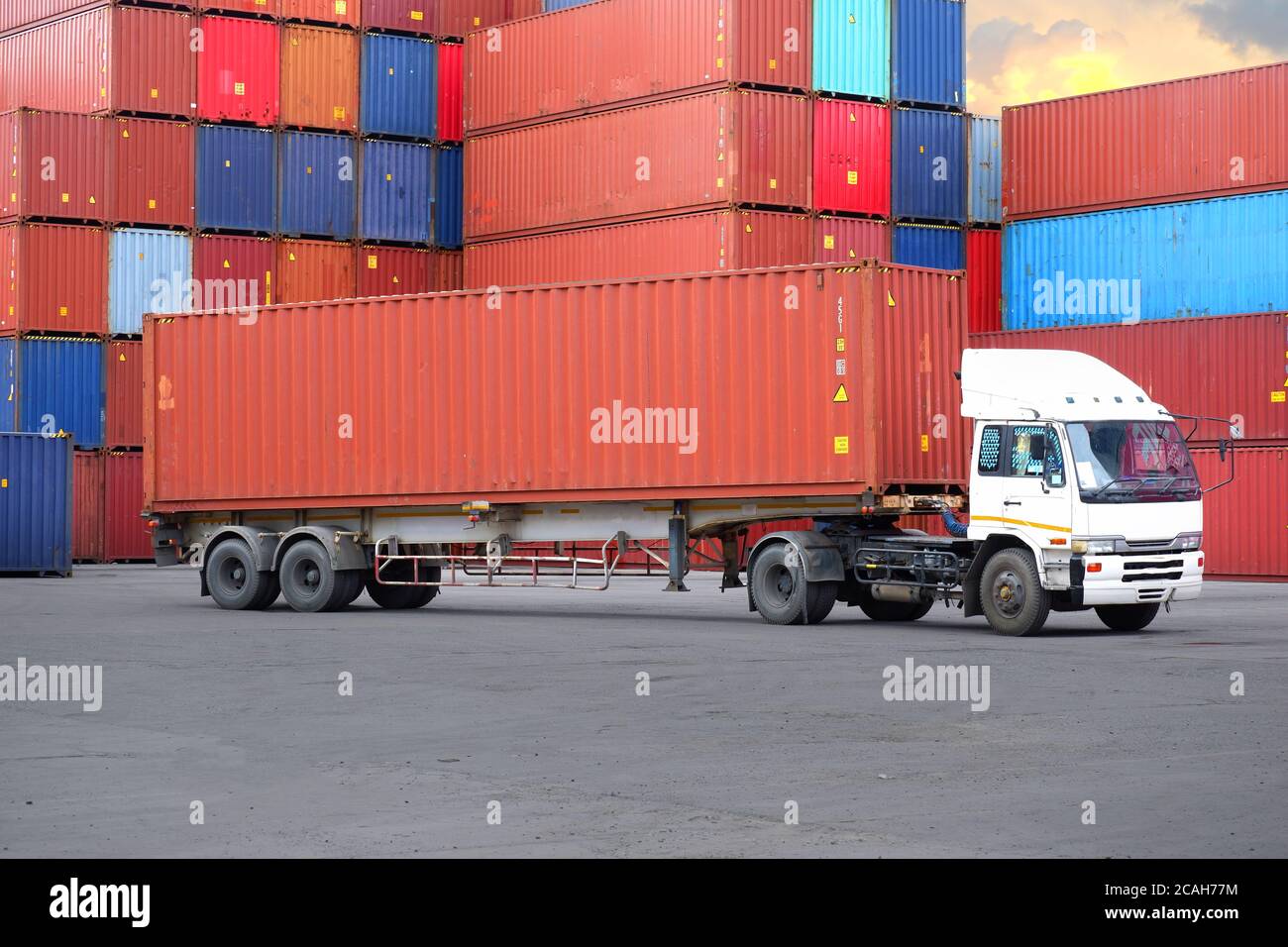 Container truck A pile of large containers on the background Stock ...