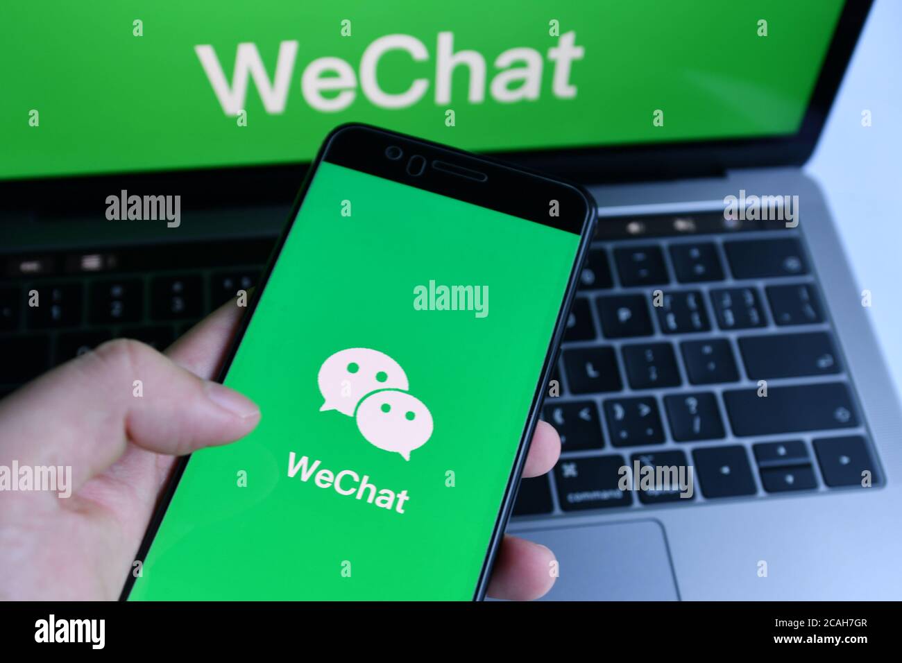 In this photo illustration, a WeChat logo seen displayed on a ...