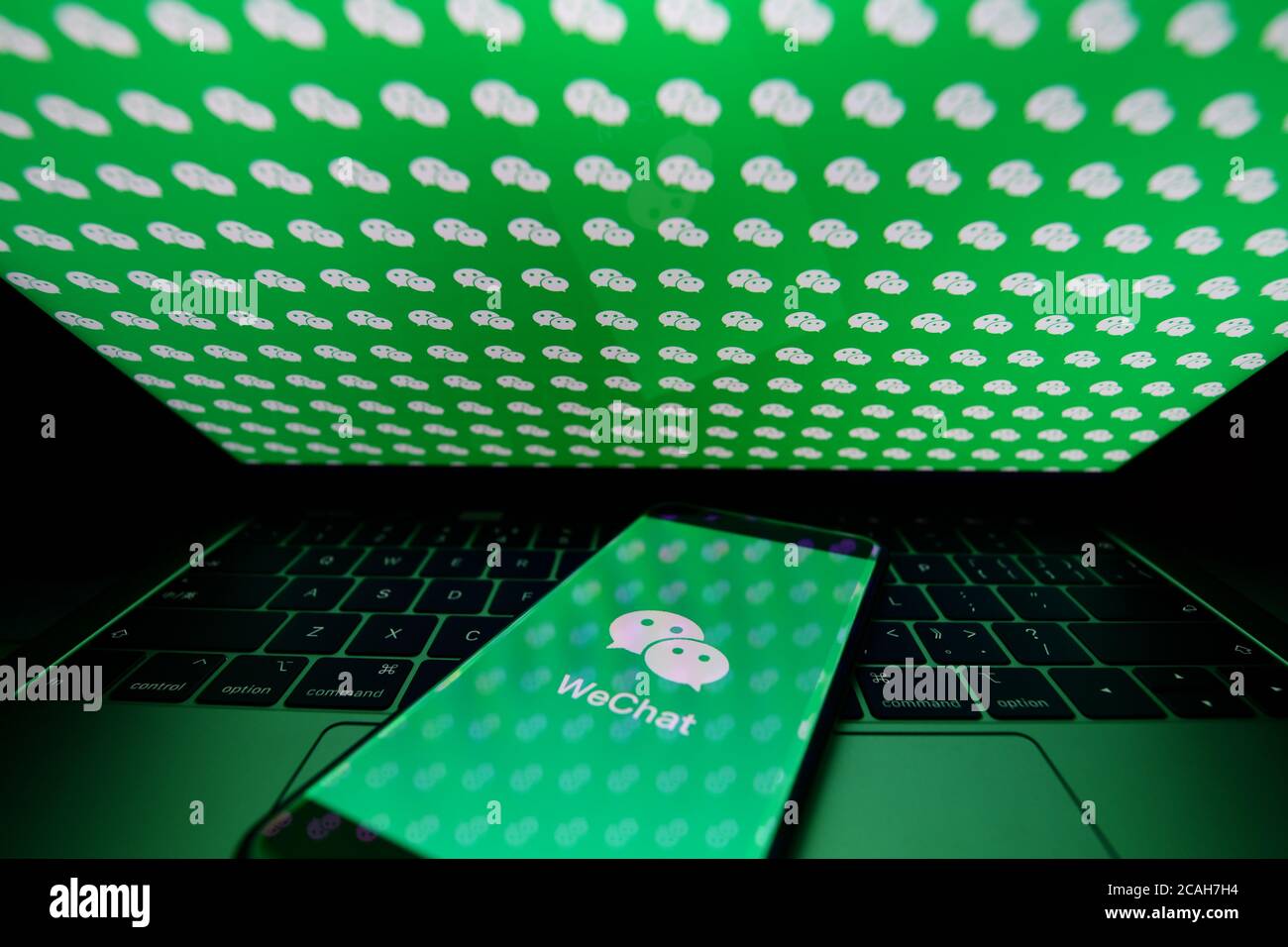 In this photo illustration, a WeChat logo seen displayed on a ...