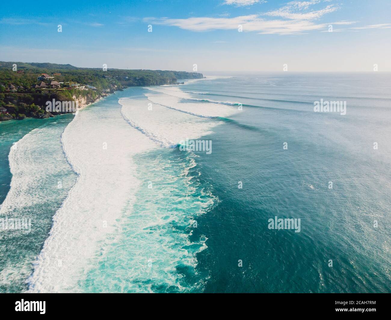 Surfing waves in ocean and coastline of Bali. Aerial view of surf spot ...