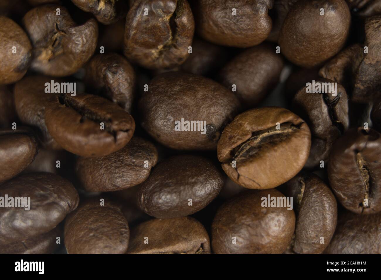 Fragrant fried coffee beans. close-up Stock Photo - Alamy
