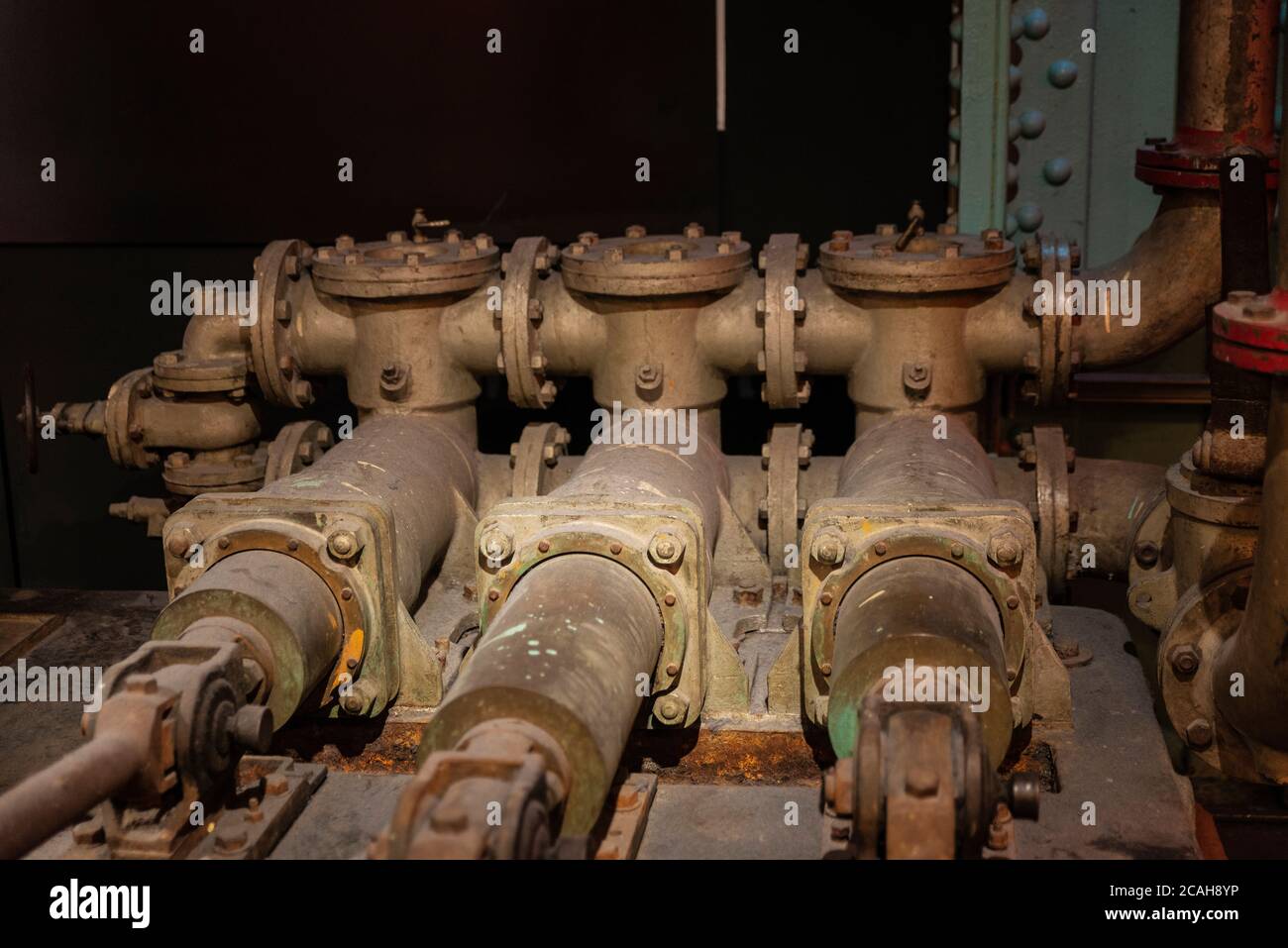 Old rusty pipes and gears of a factory as background in Dublin, Ireland ...
