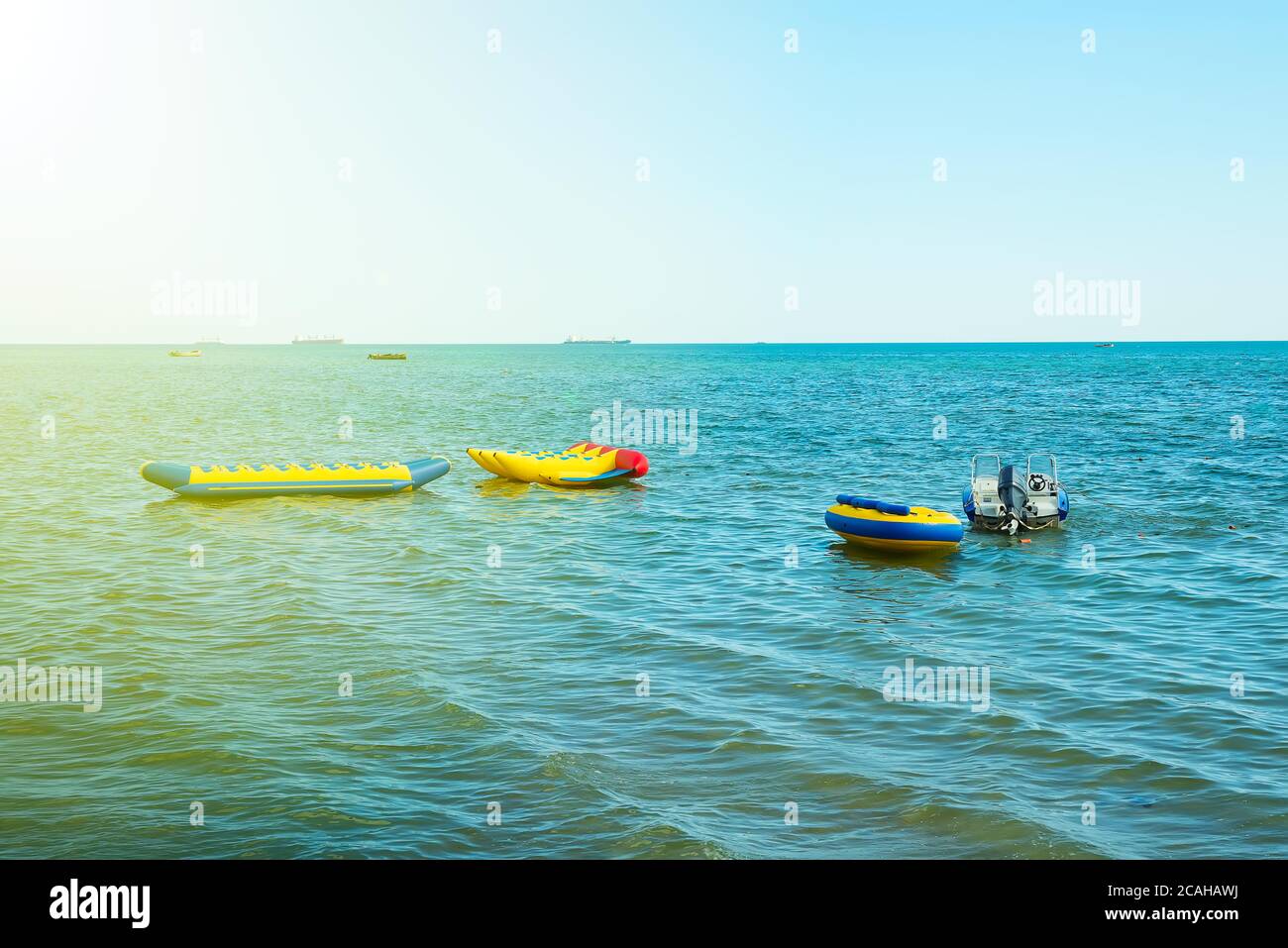 Marine landscape with inflatable water ride banana without people on a ...