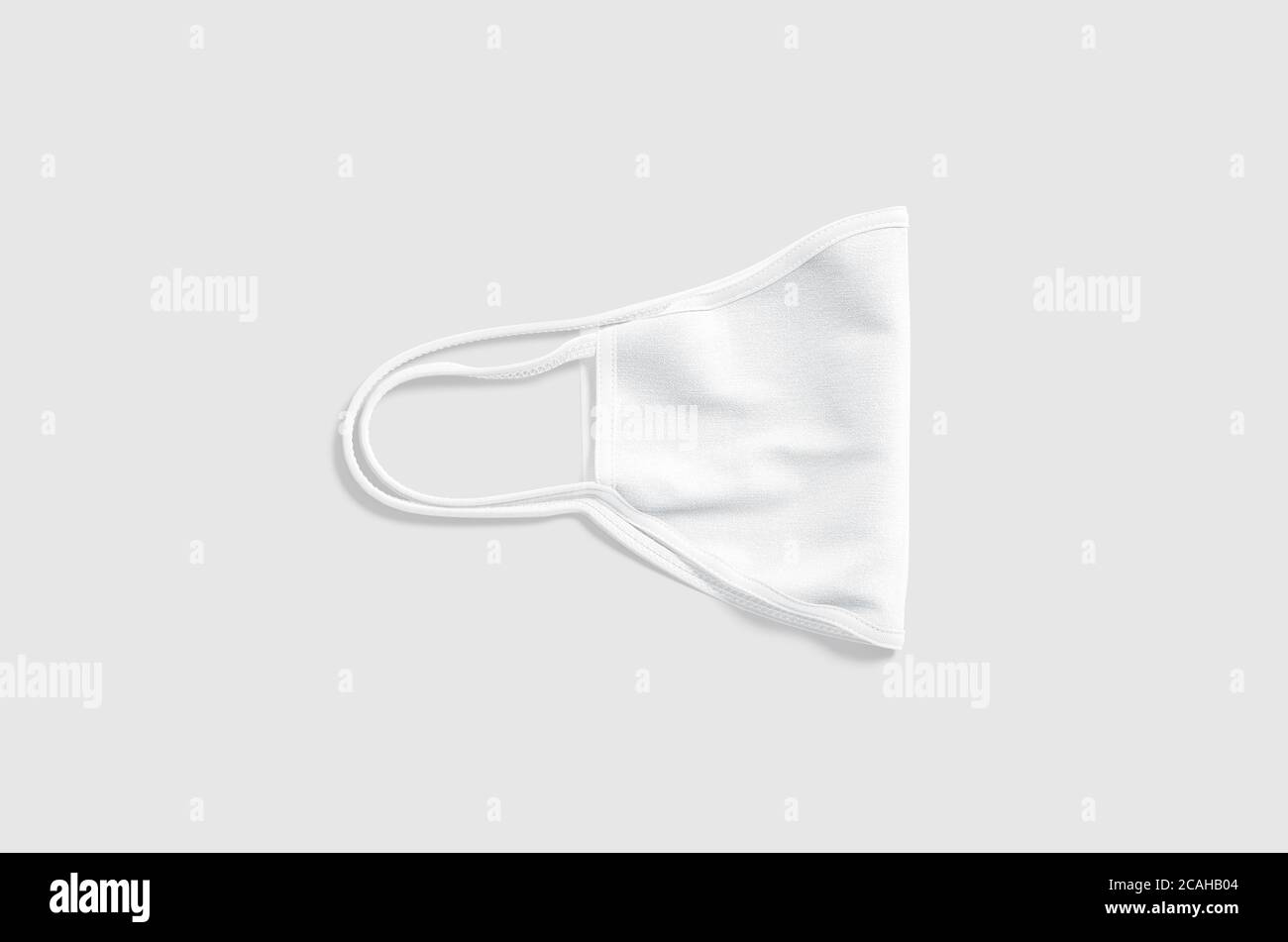 Blank white fabric folded face mask mockup lying, gray background Stock ...