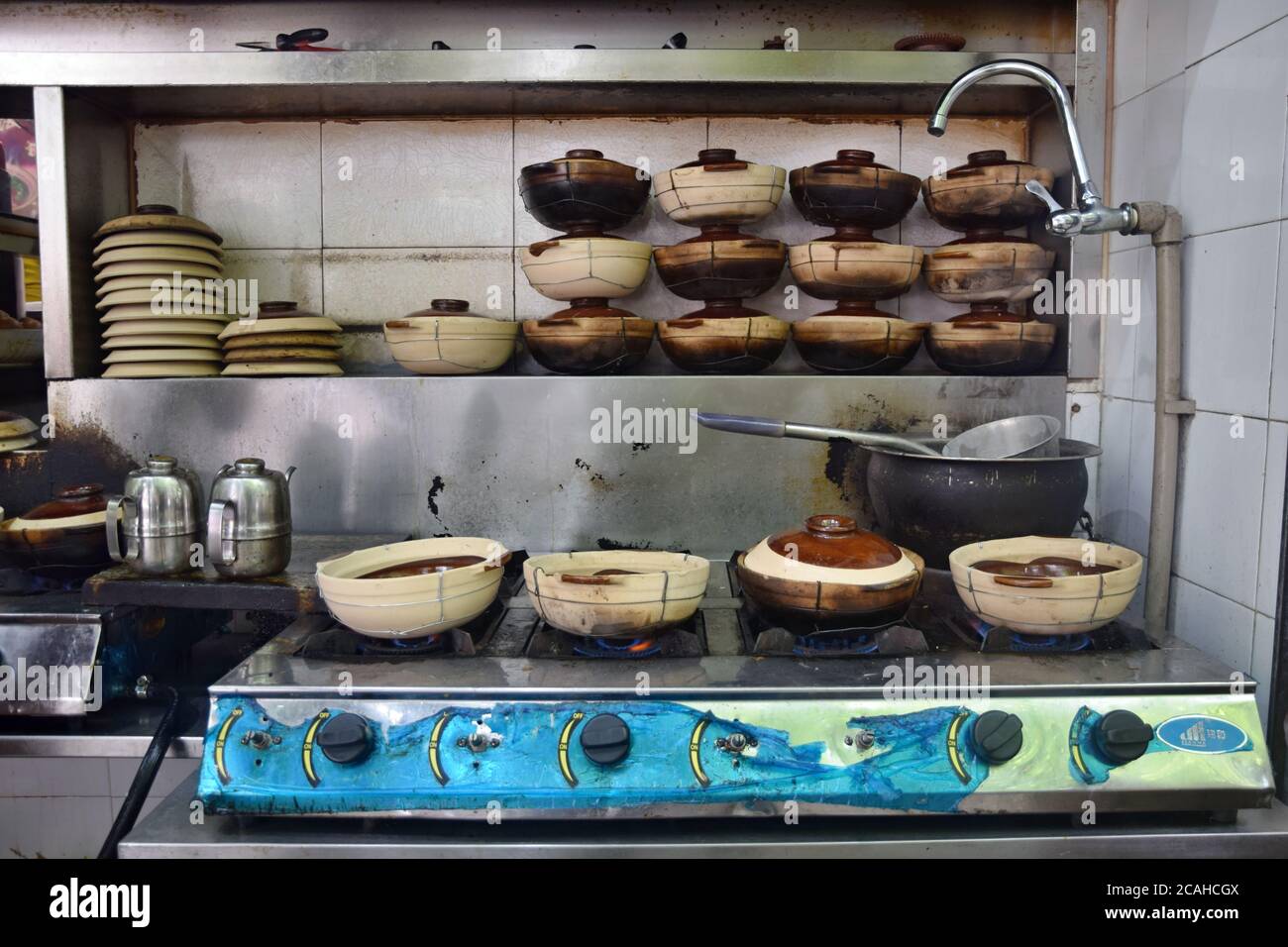 The clay pots in China are used for a popular Cantonese-style dish ...