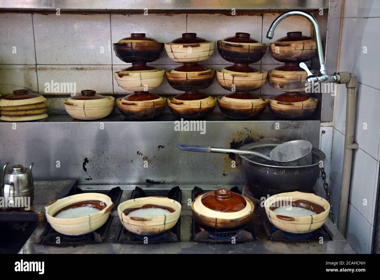 The clay pots in China are used for a popular Cantonese-style dish ...