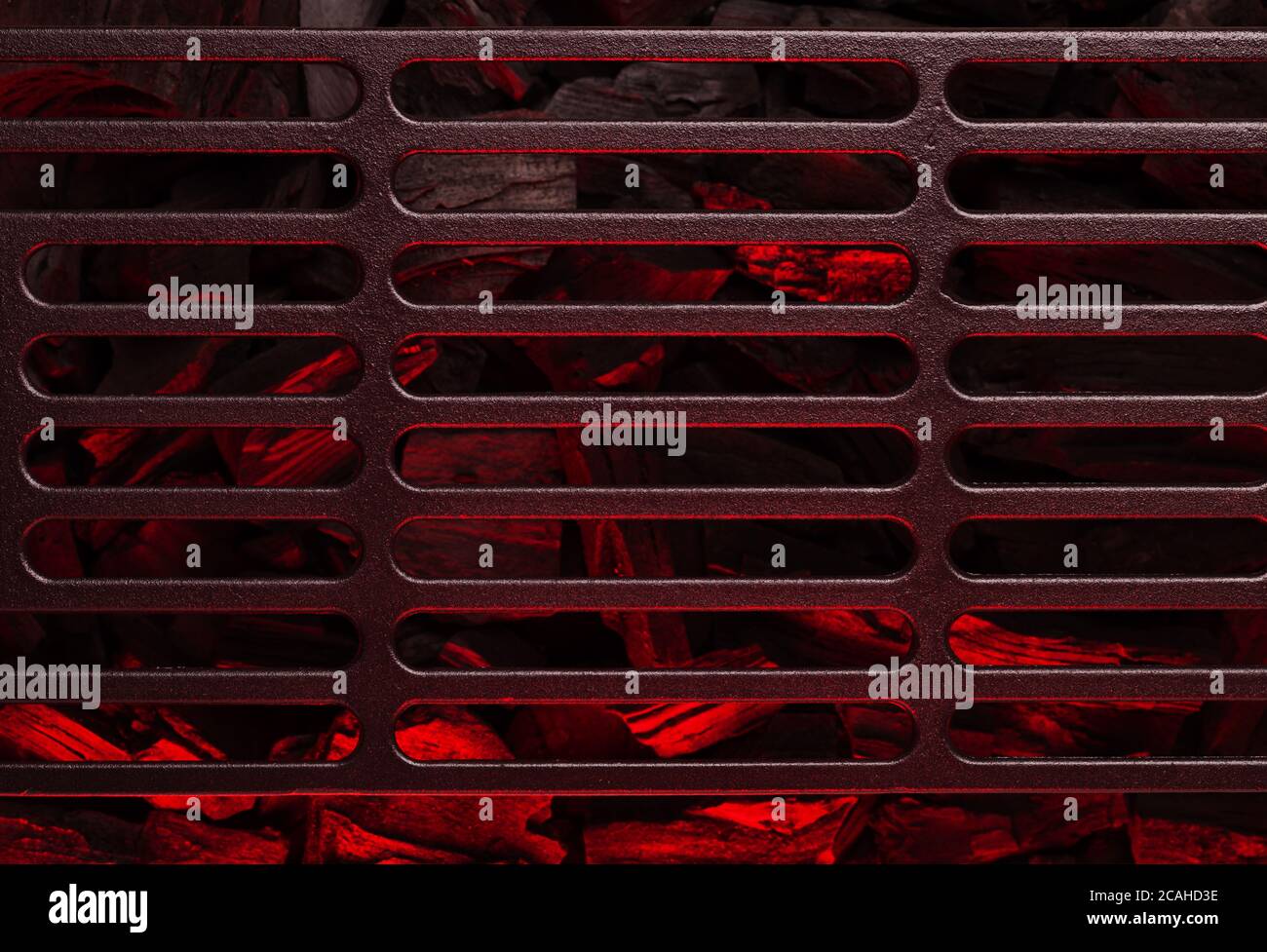 Metal barbecue grill over hot coal. Top view flat lay. Backdrop for ...