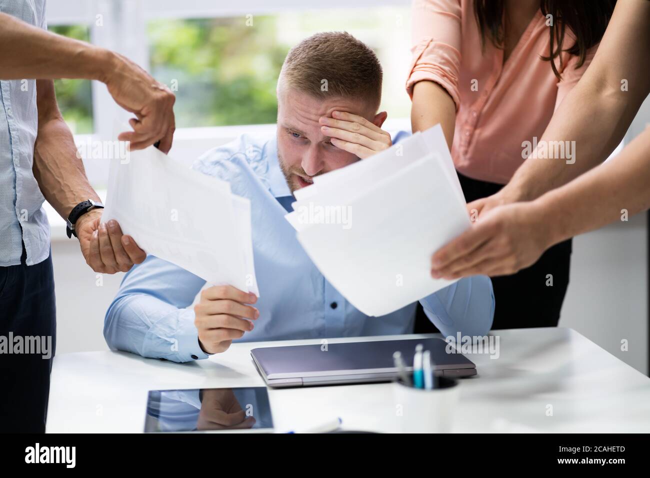 Stress At Workplace In Office. Business Headache Stock Photo - Alamy