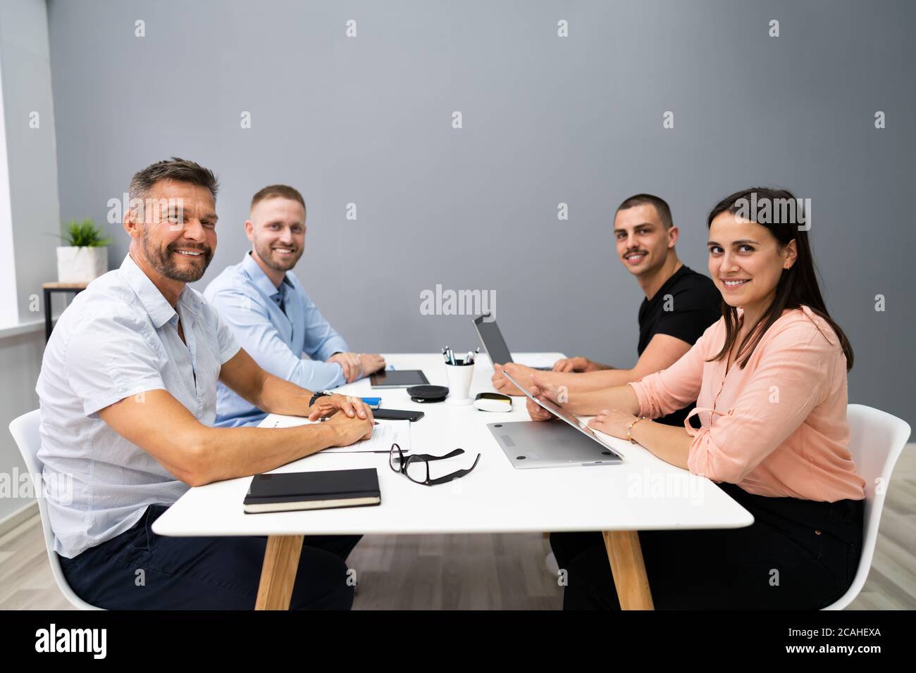 Smart Business People Team Collaborating In Office Stock Photo - Alamy