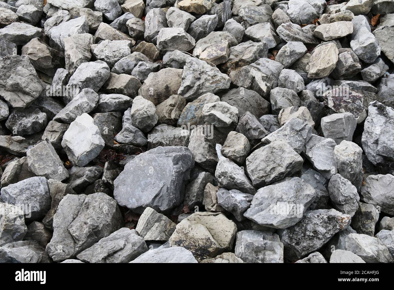 pile of odd shaped natural stone block boulders rocks with shadows ...