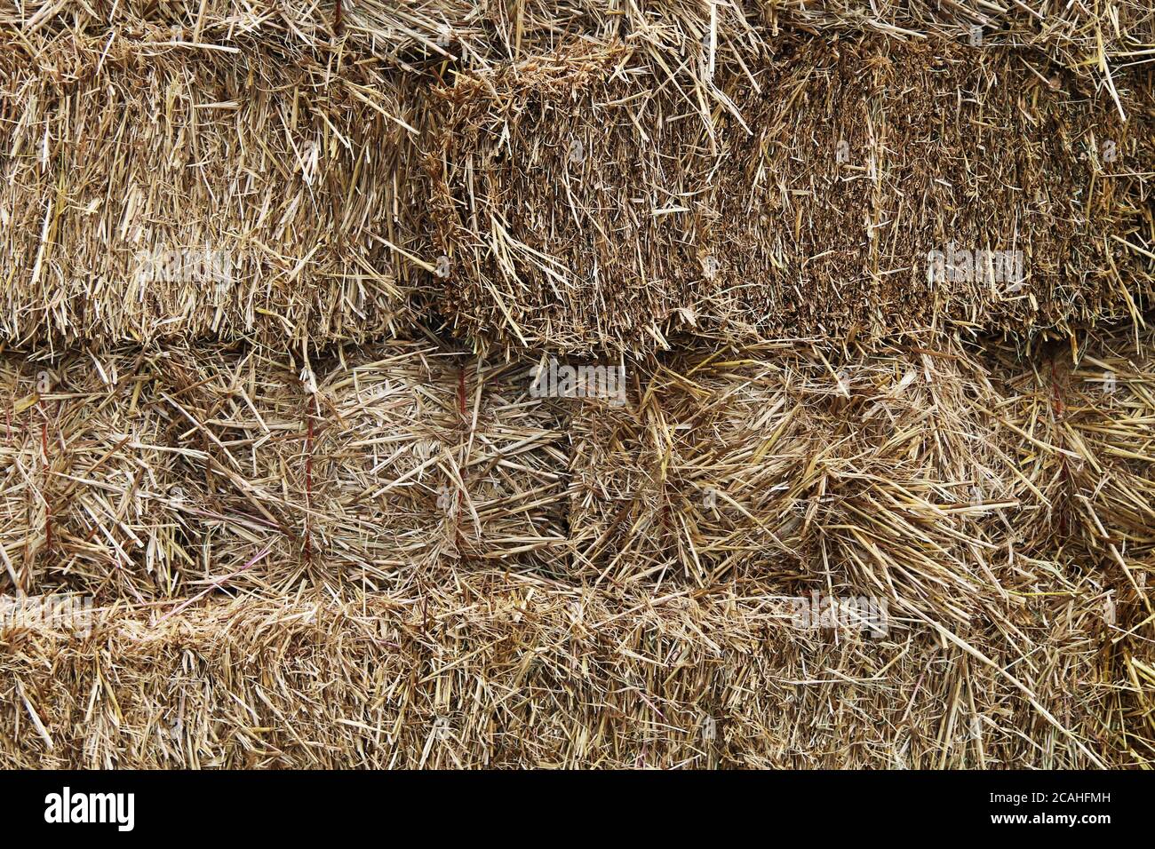 natural hay fodder feed straw bale stacked binded bound close-up ...