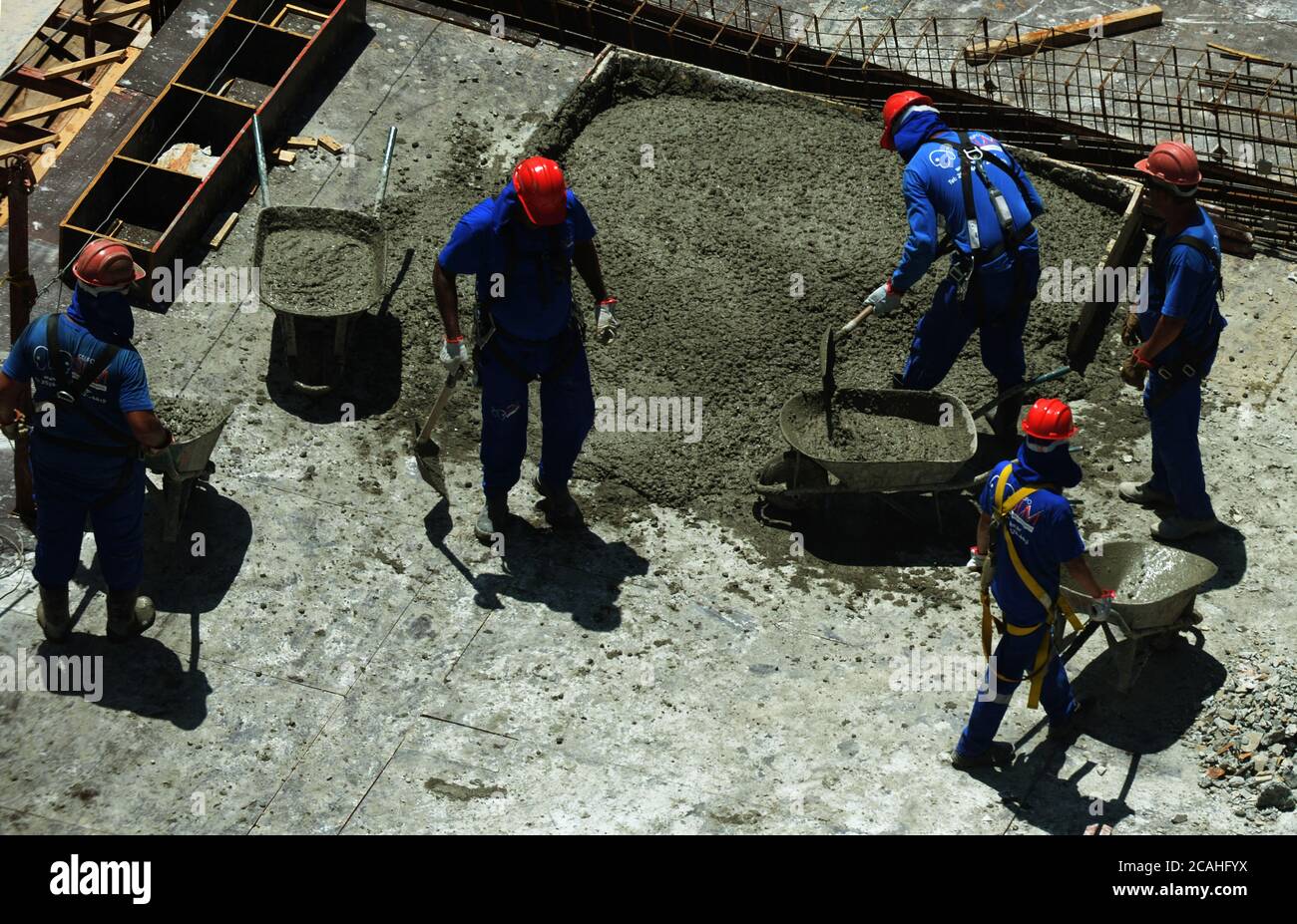 Rio de Janeiro, Brazil November 13th, 2018 Workers transport cement as ...