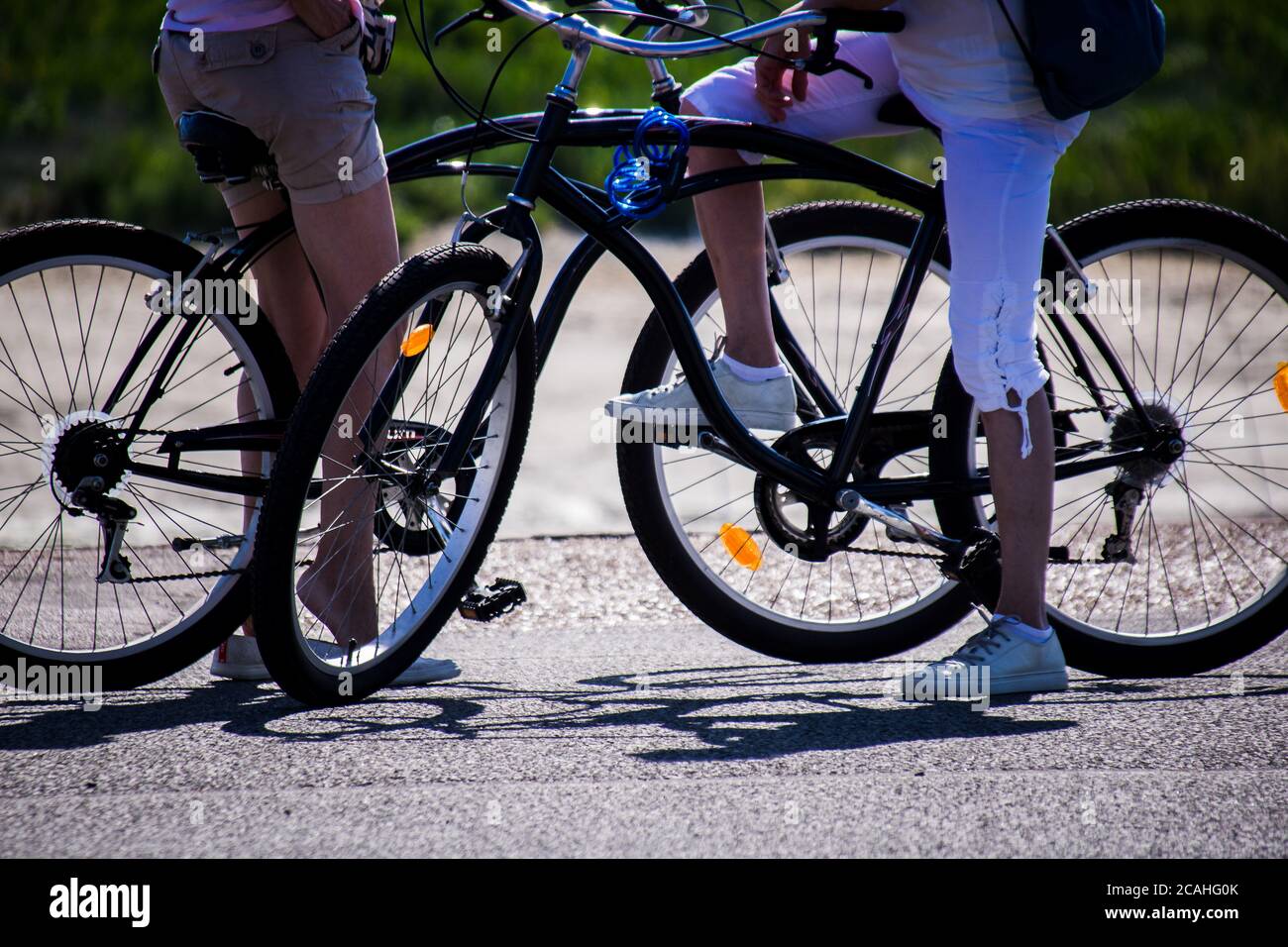 Young friends riding bike hi-res stock photography and images - Alamy