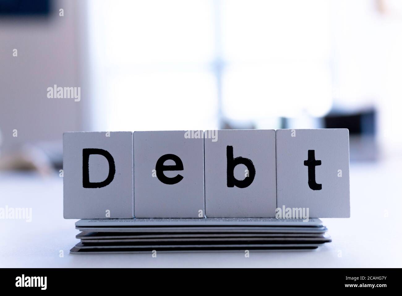 Skeleton hand holding credit cards to illustrate credit card debt Stock ...
