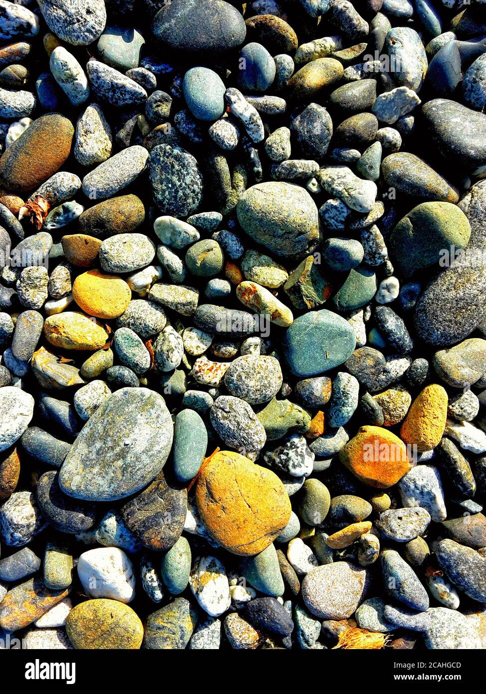 Vertical shot of pebbles background Stock Photo - Alamy
