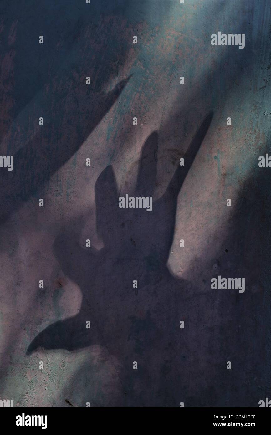 Vertical shot of a hand shadow on the wall Stock Photo - Alamy