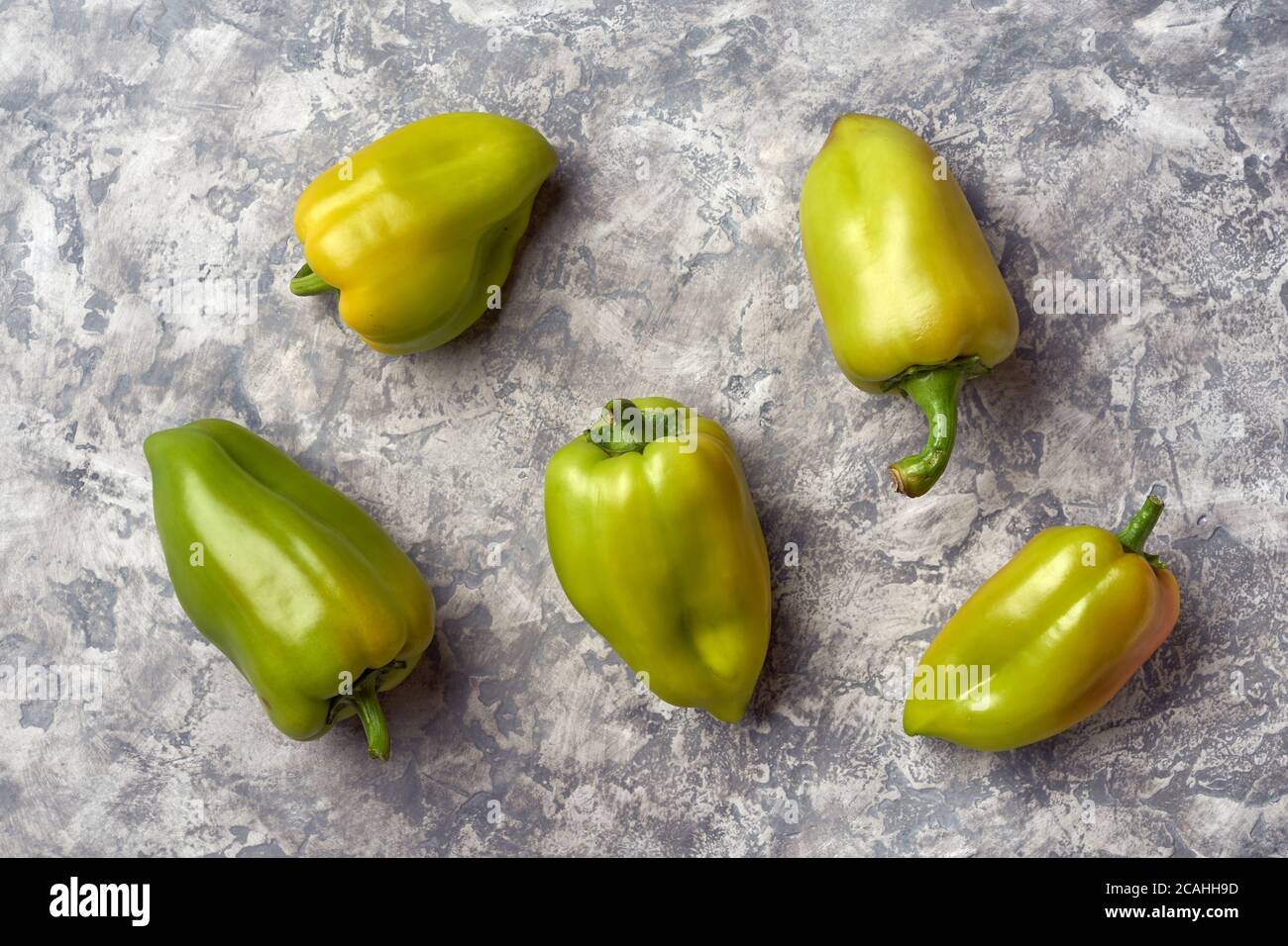 Top view of fresh raw green pepper on textured gray background Stock ...
