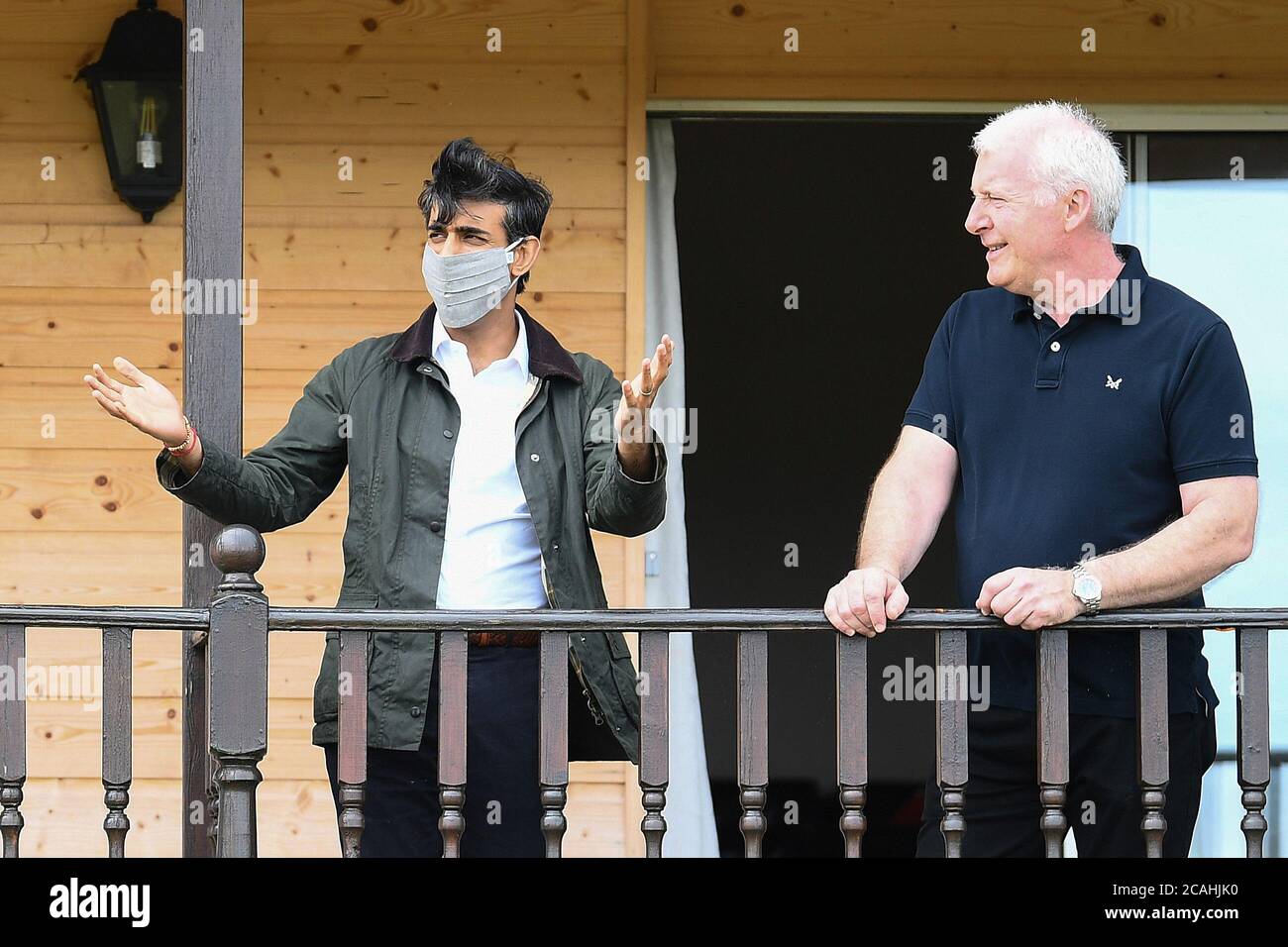 Chancellor of the Exchequer Rishi Sunak (left) meets with local ...