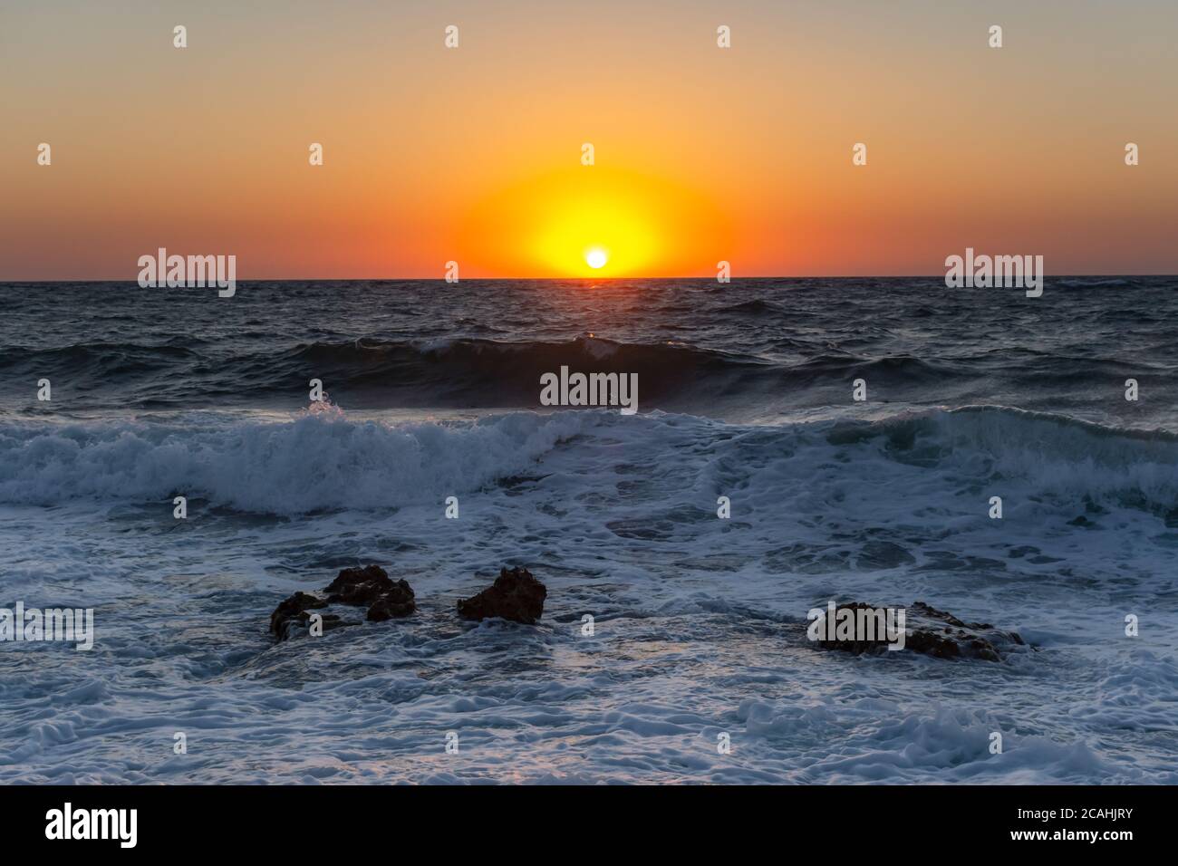 Sunset and storm at sea. Large waves against the background of the ...