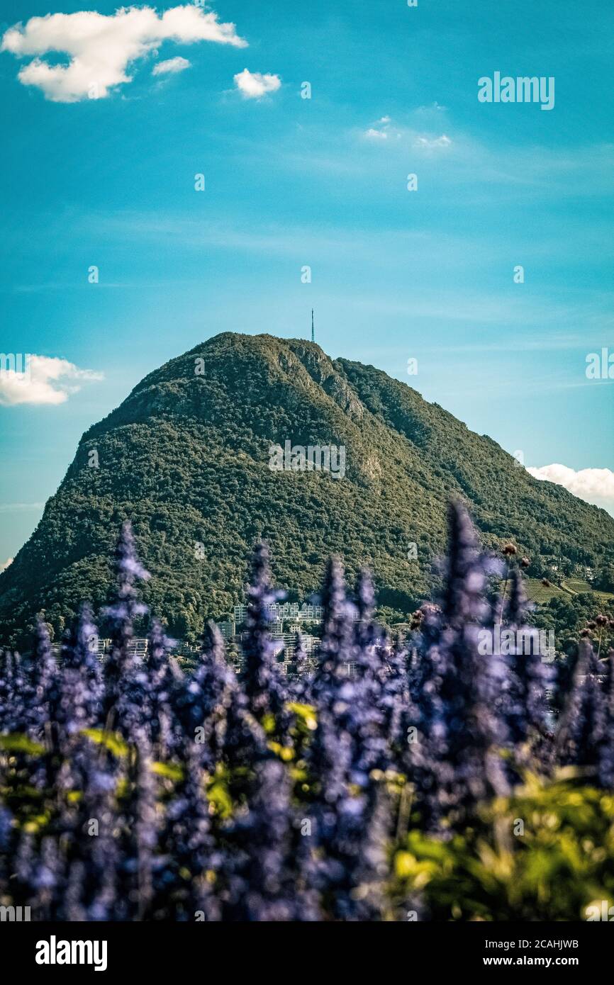 Scenic vertical shot of Mount Bre from Lake Lugano located in Lugano ...