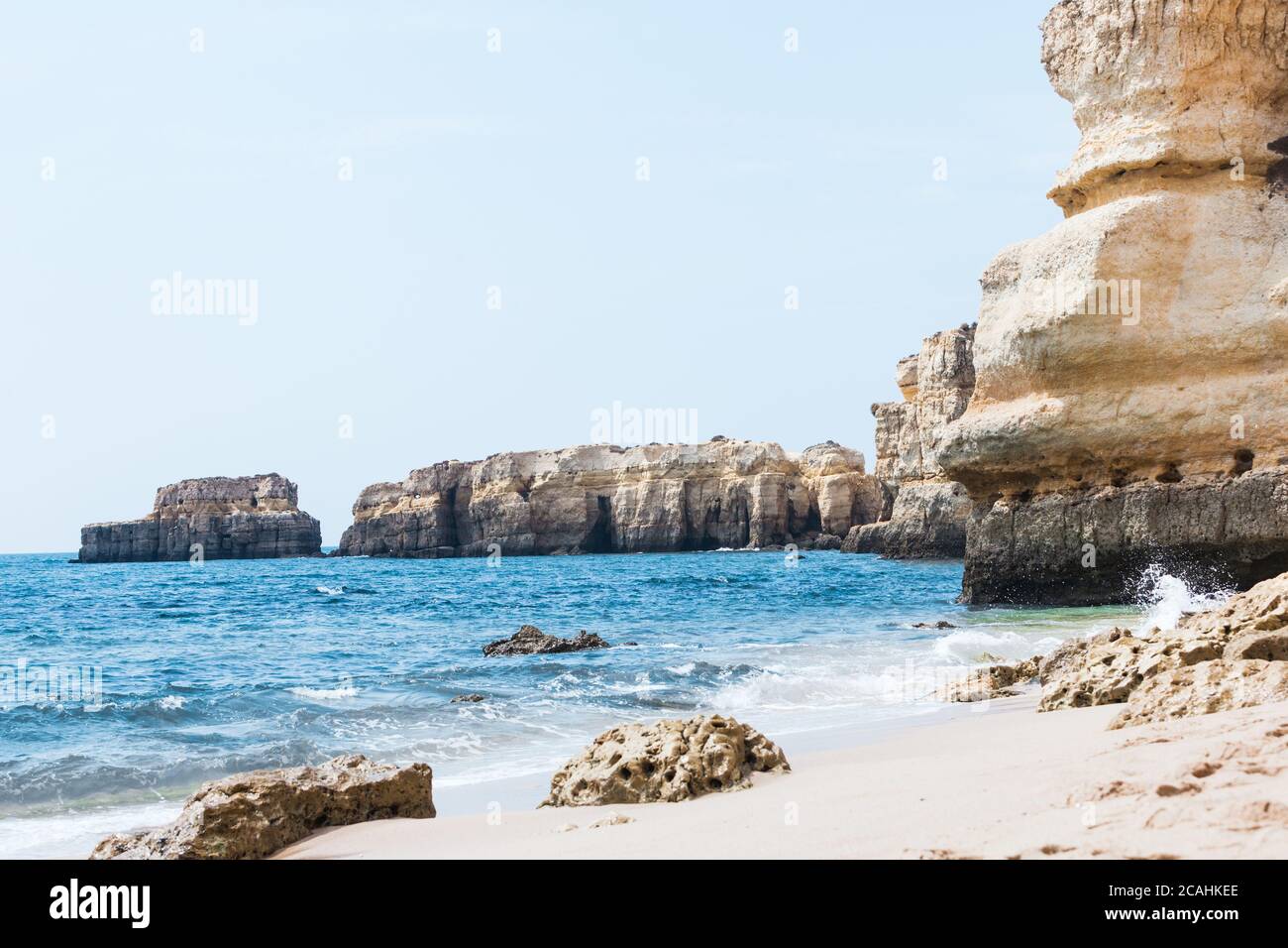 Sea stacks and rock cliffs at a shore Stock Photo - Alamy