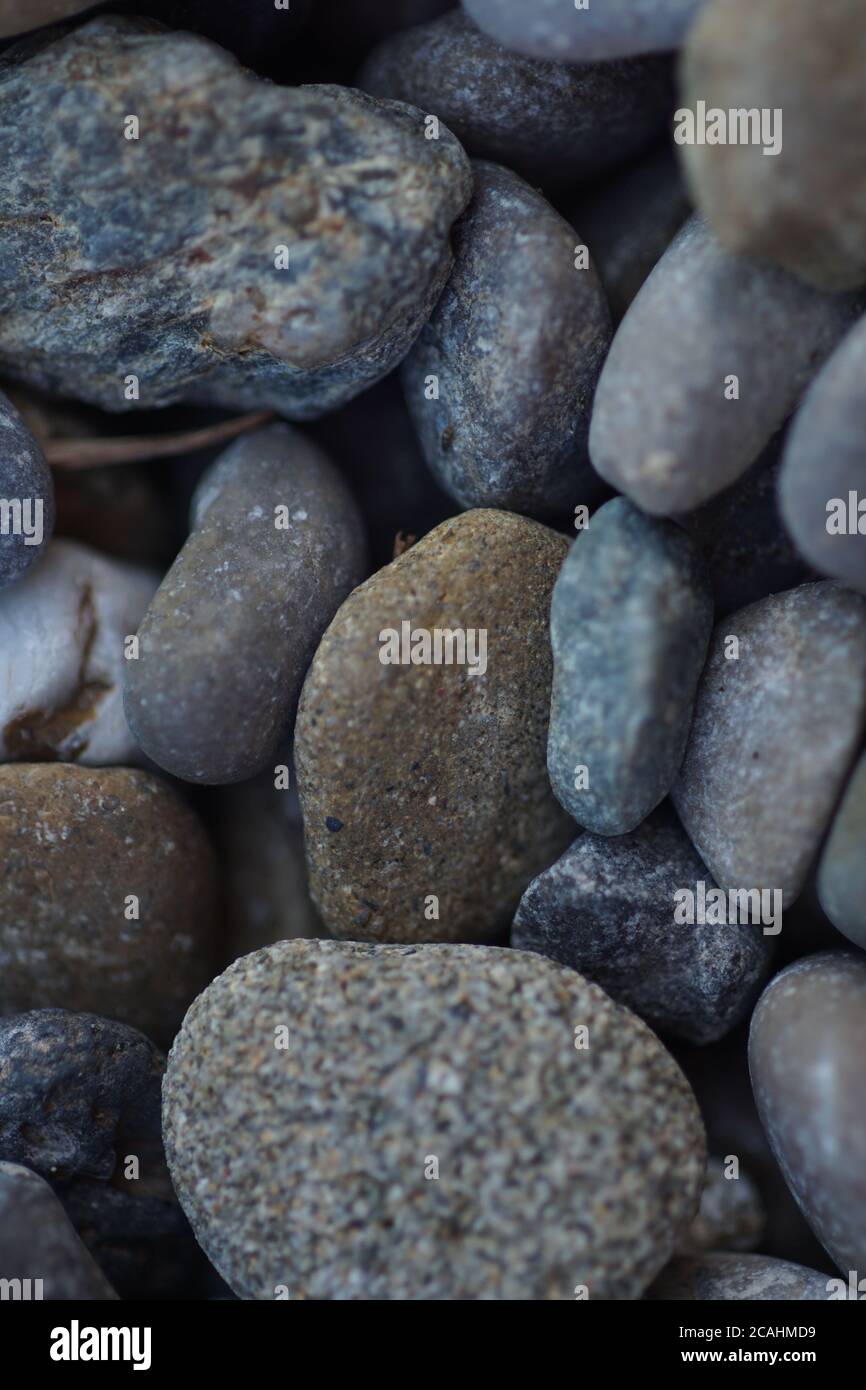Closeup shot of many sandstones and granite round stones of various ...