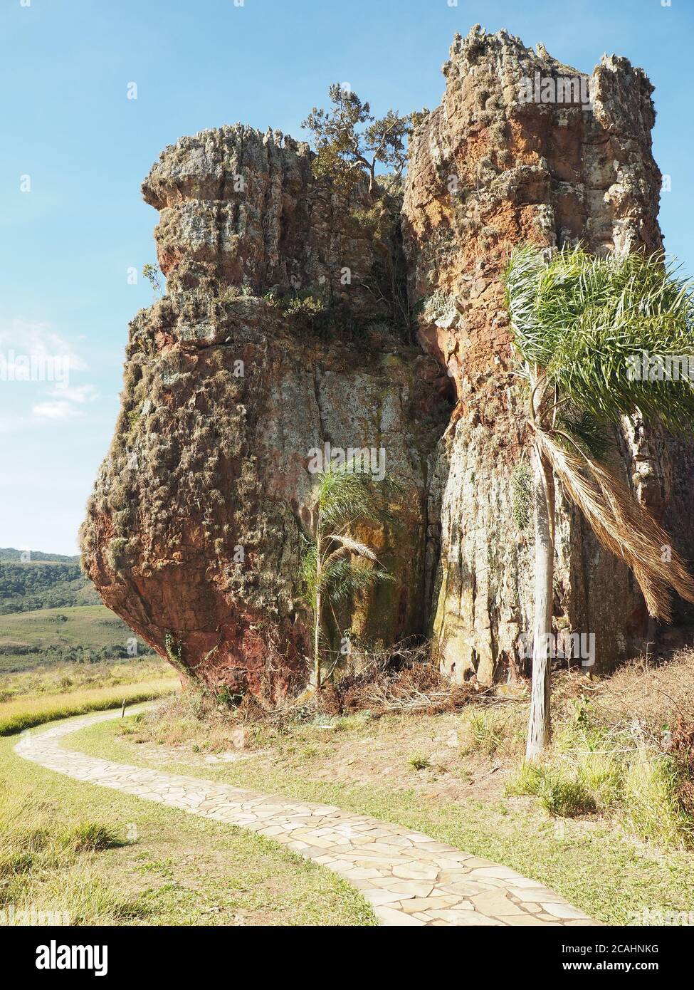 Vertical low angle shot of the summit of a cliff captured during the ...