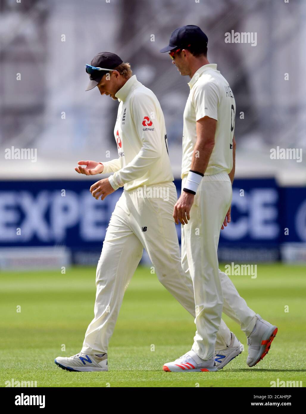 England's Joe Root leaves the pitch after he picks up an injury on his ...
