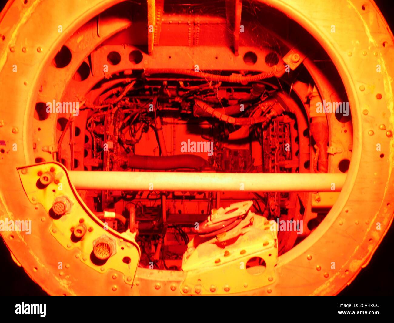 inside tail of disused abandoned Helicopter grounded at night with red ...