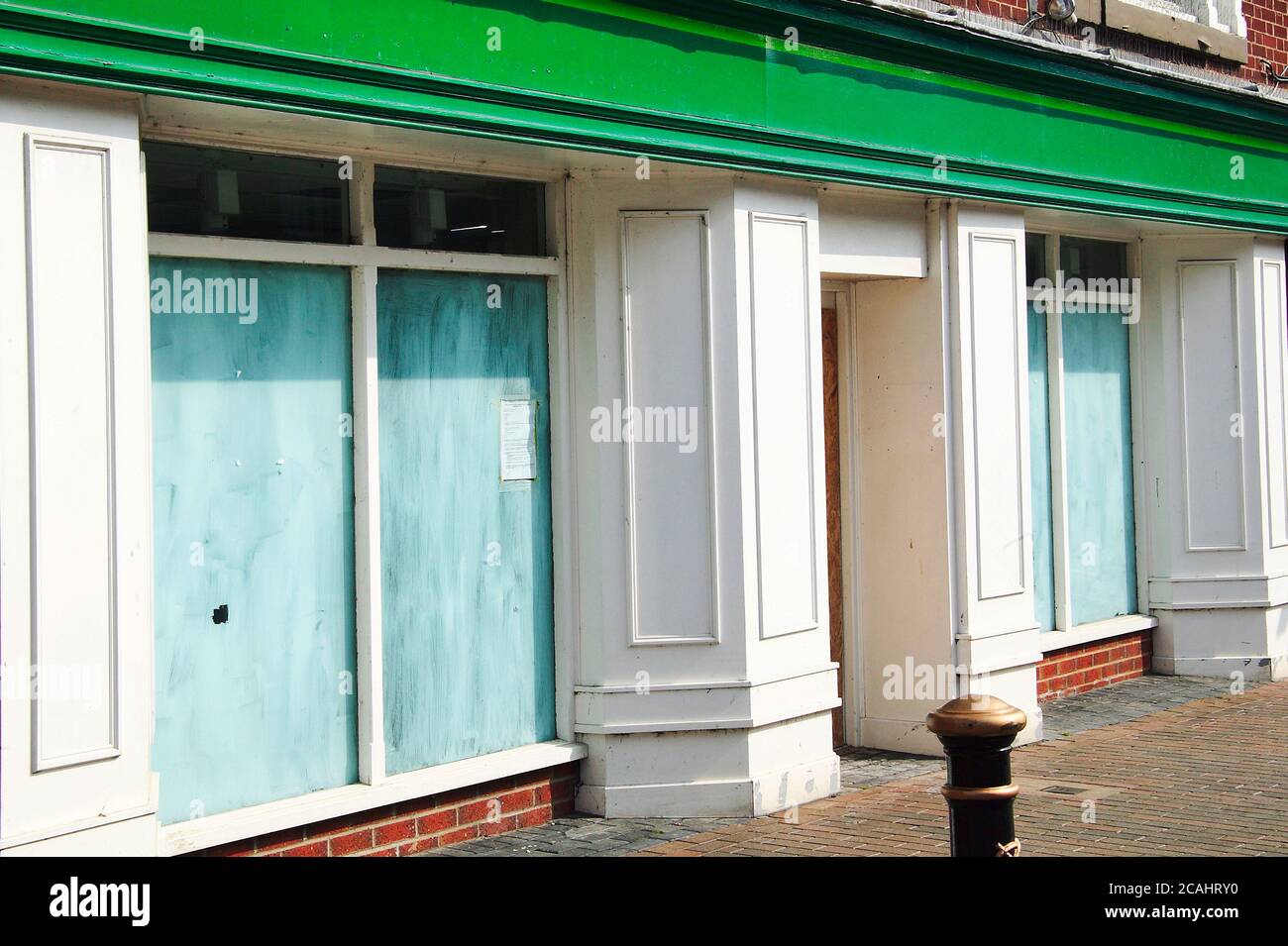 Bankrupt closed down empty retail shop store business with whitewashed ...